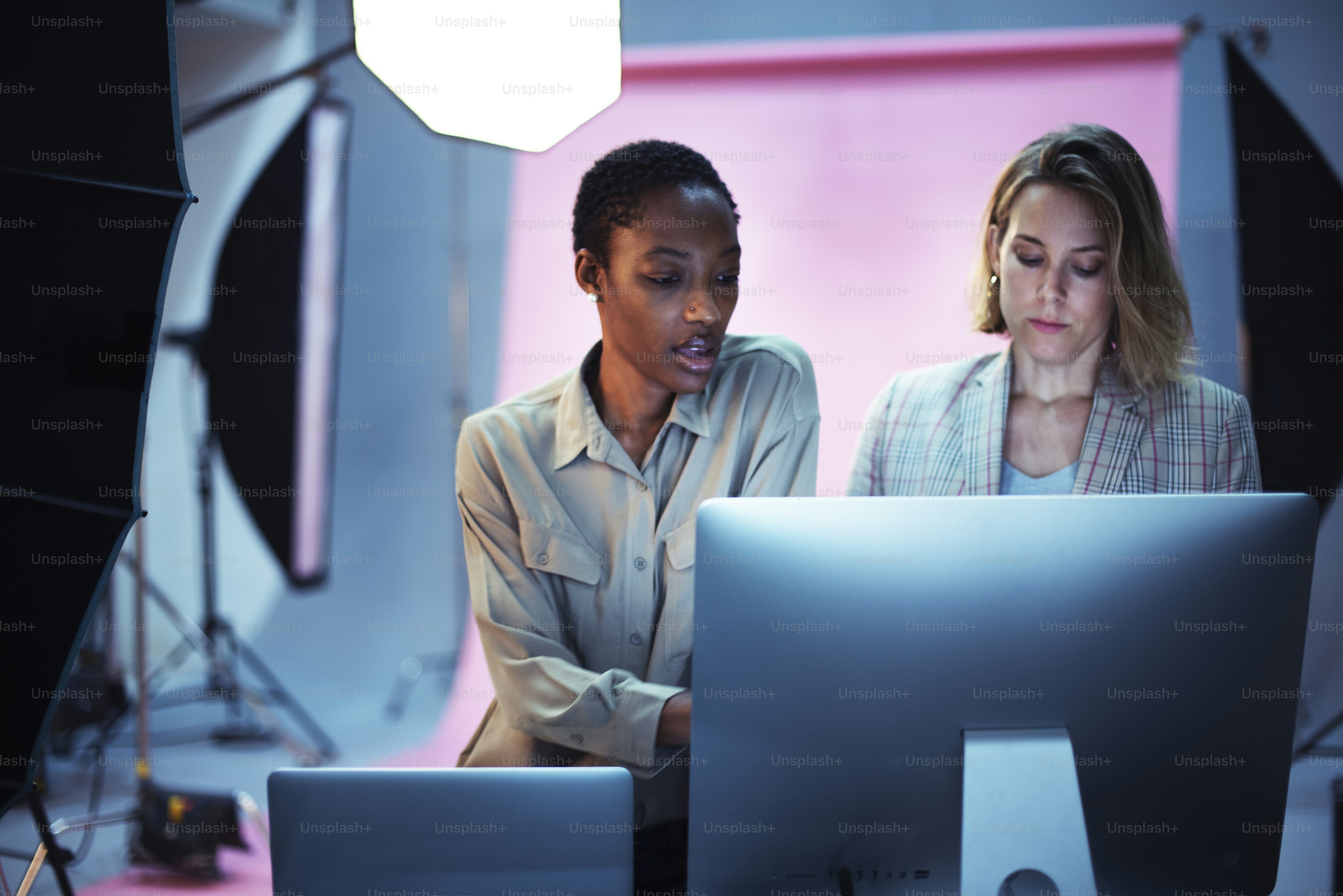 Art director checking the shots on the monitor photo – Computer monitor ...