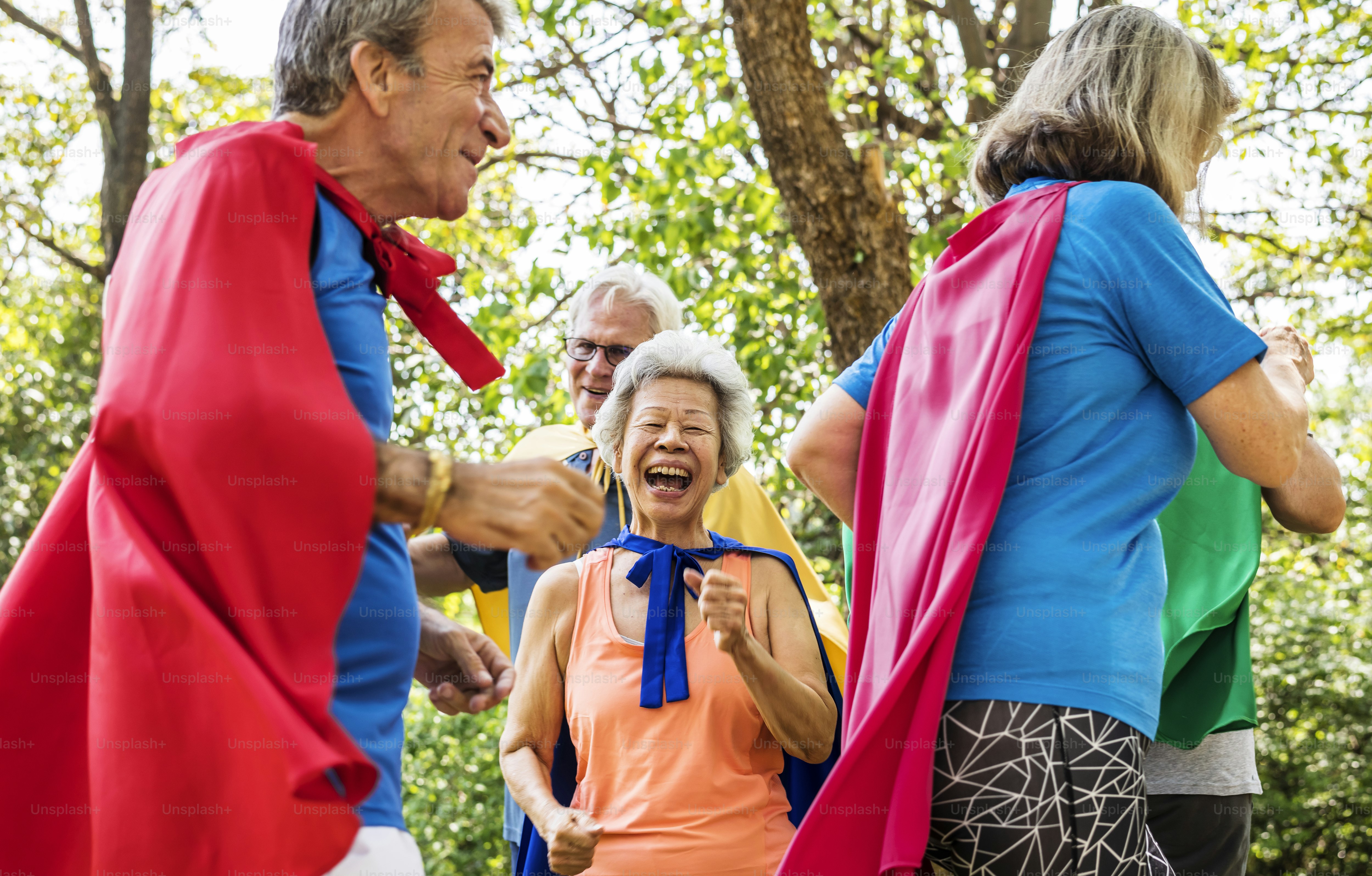 Childlike seniors wearing superhero costumes photo – Photography Image ...