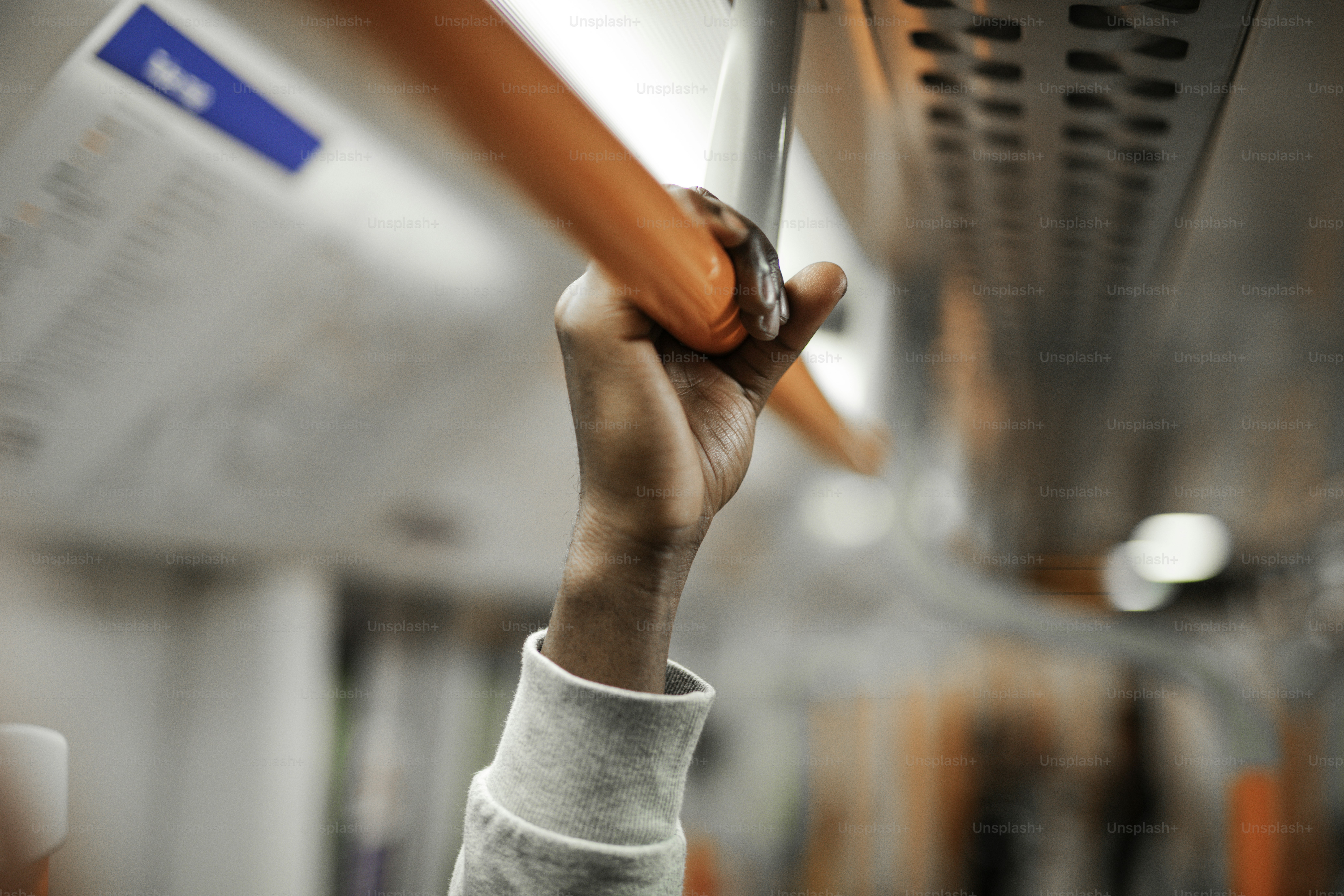 Man holding on to a handrail on a train photo – Subway Image on Unsplash