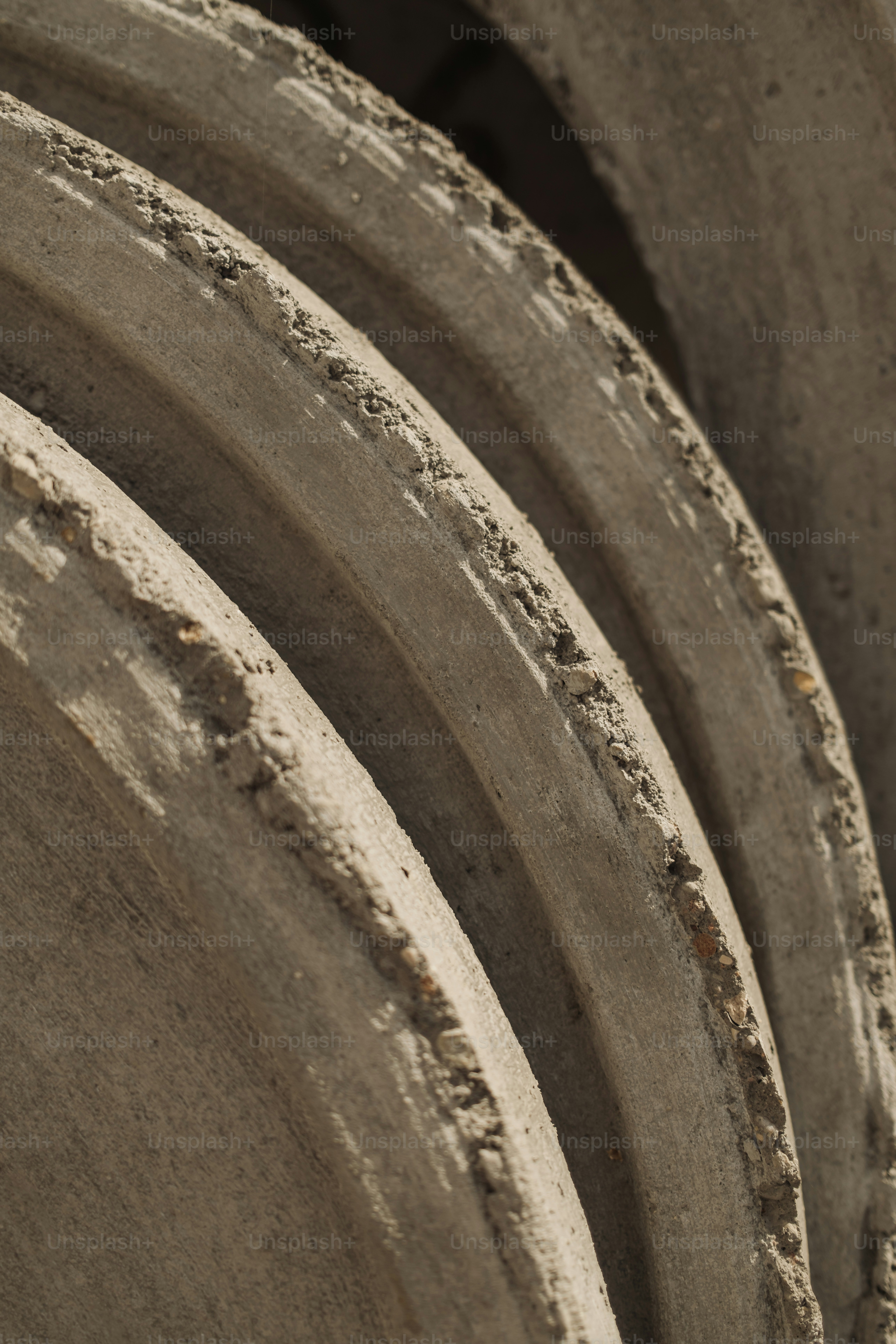 A close up of a bunch of cement plates photo – Minimalist Image on Unsplash
