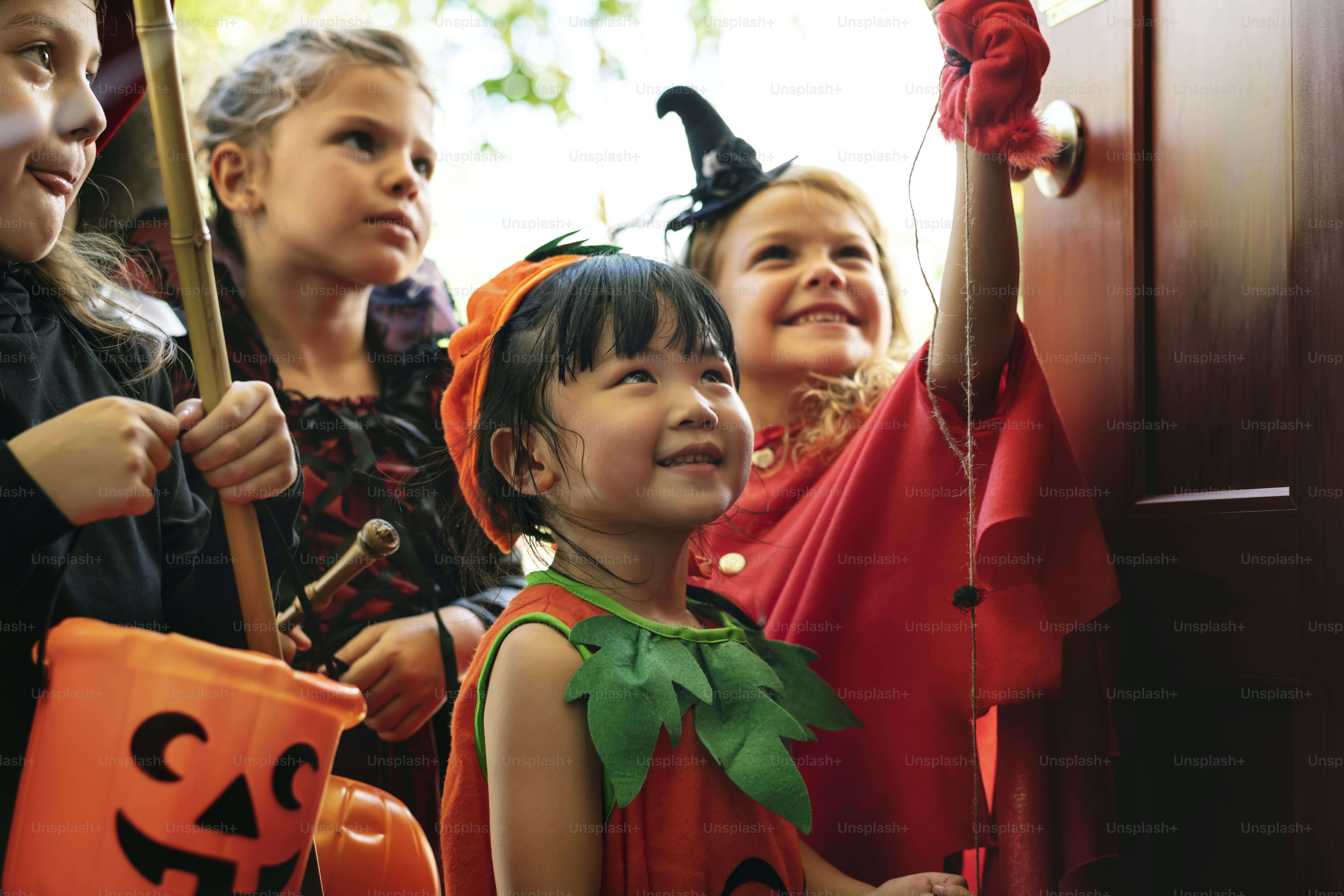 Little children trick or treating on Halloween photo – Halloween Image ...