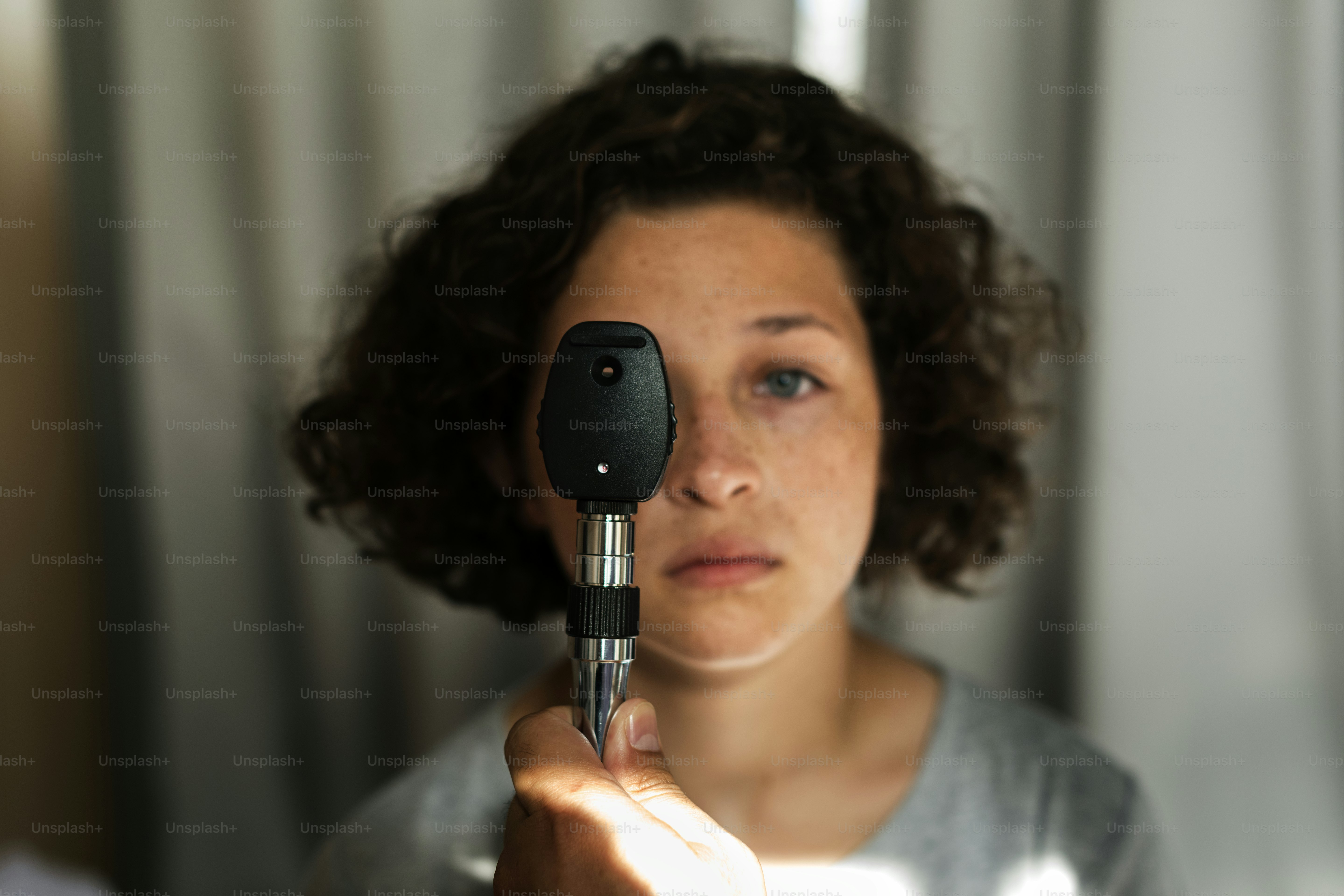 Young Caucasian girl is getting eyes examine photo – Eyesight Image on ...