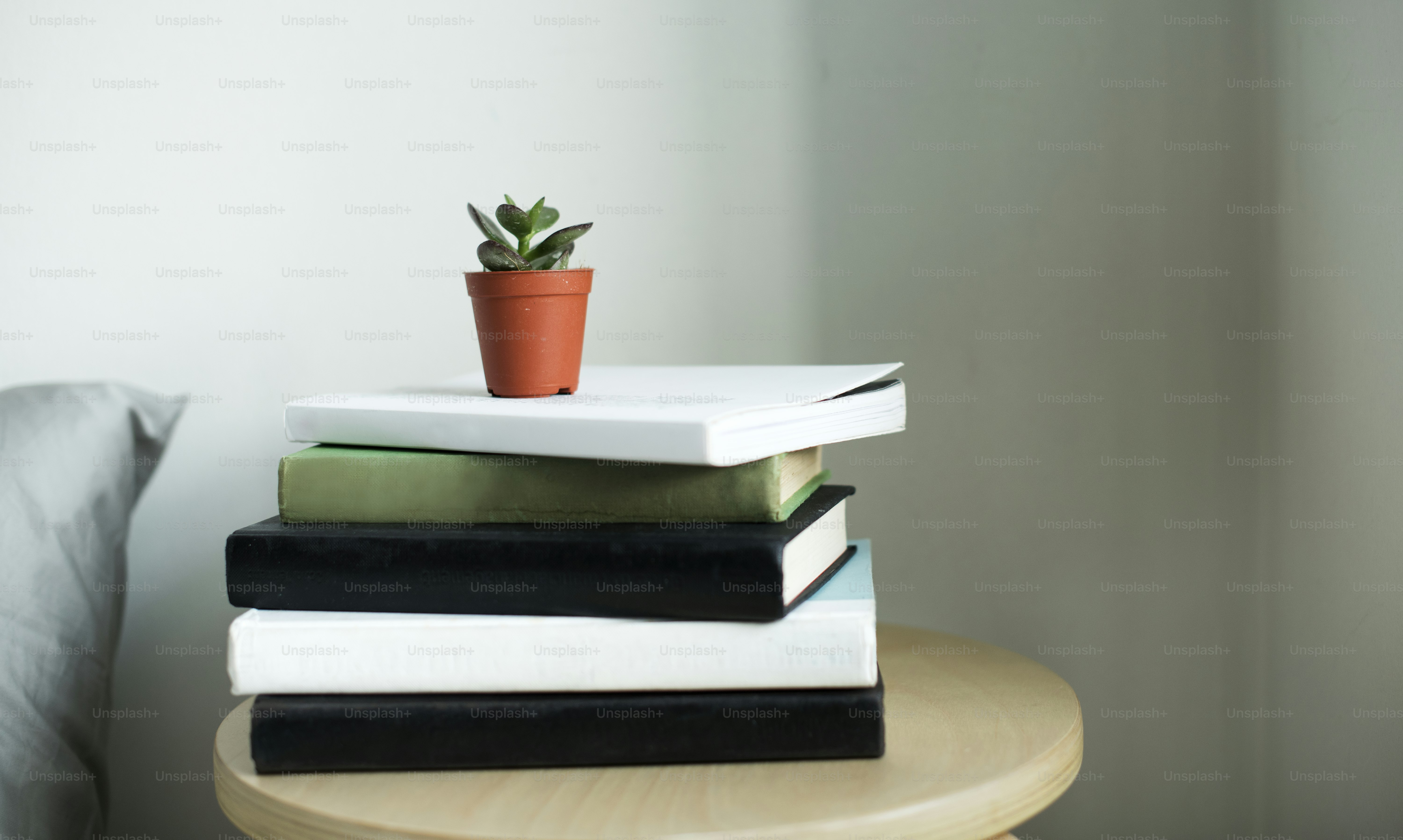 Books stack on the table photo – House Image on Unsplash