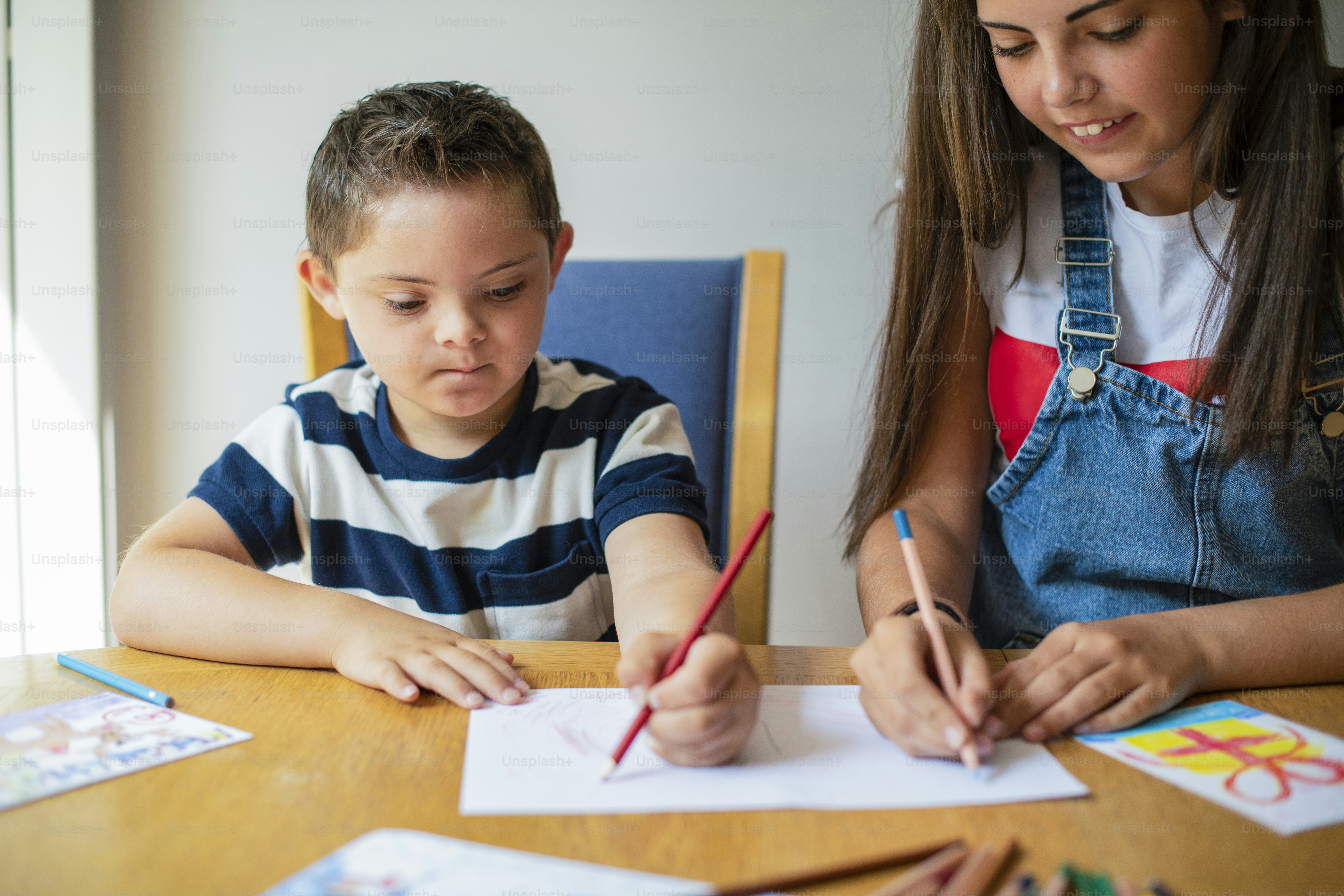 Girl helping her brother to draw photo – Art Image on Unsplash