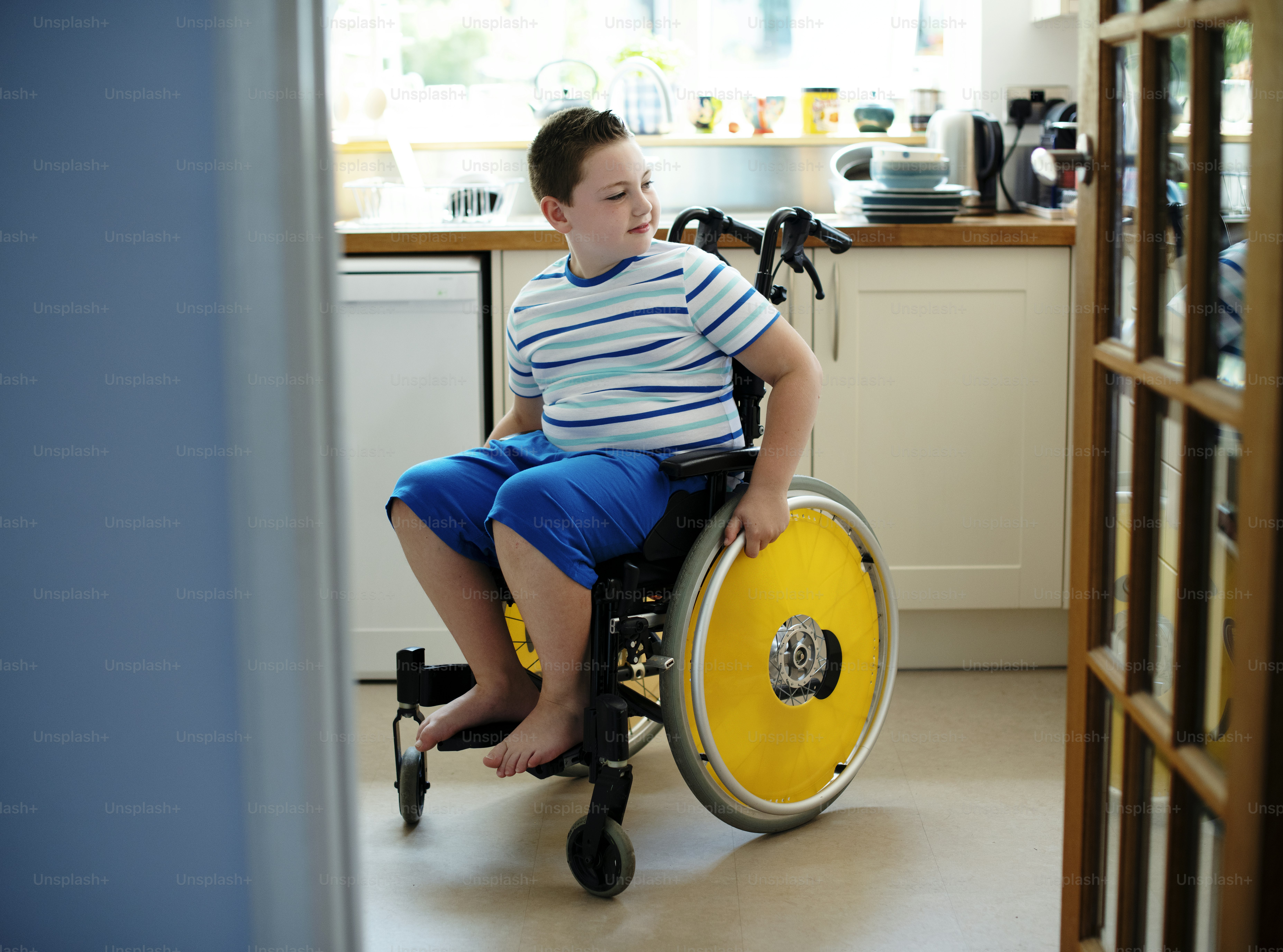 Young boy in a wheelchair photo – Uk Image on Unsplash