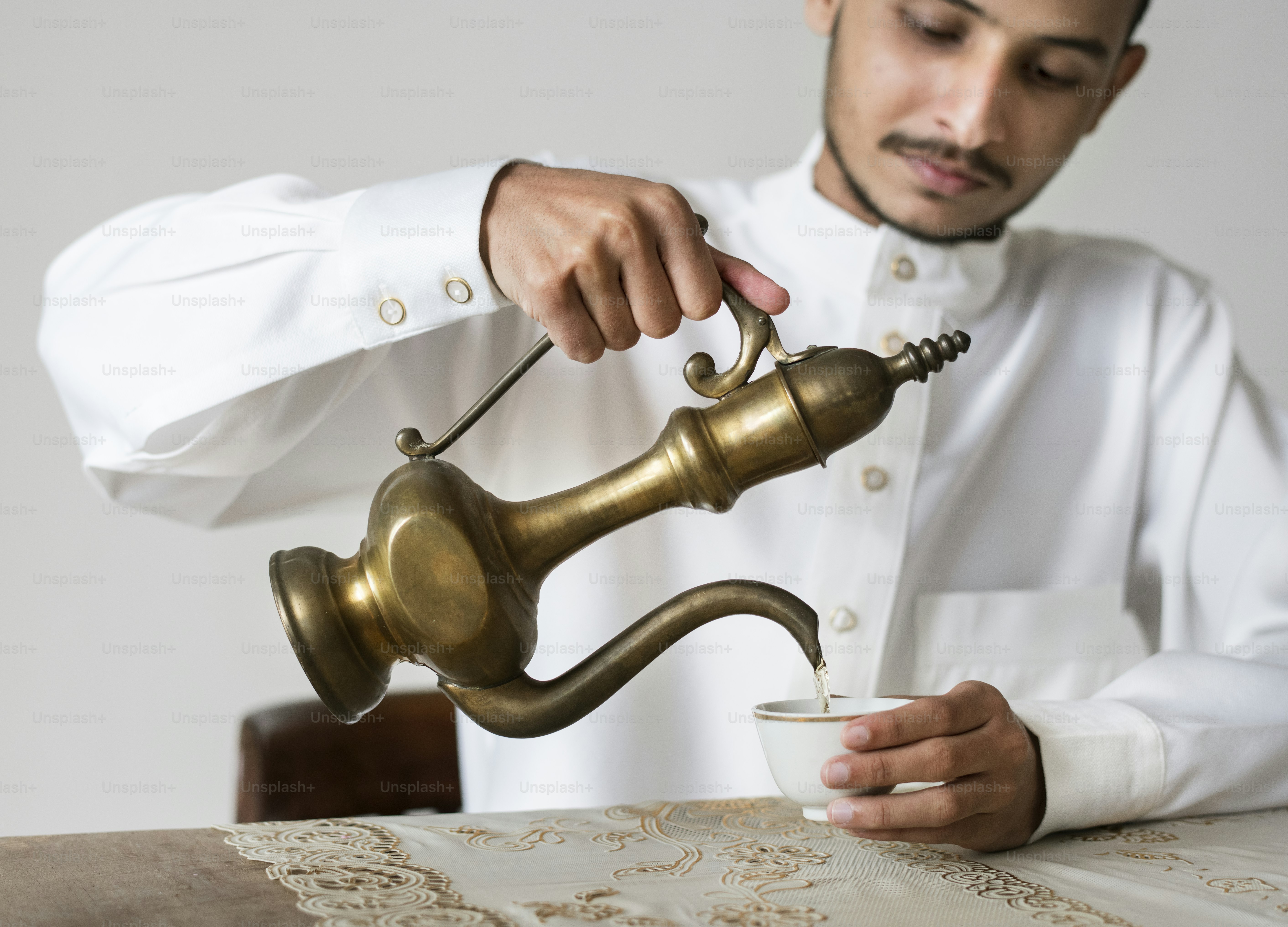 Muslim man having a cup of tea photo – Tradition Image on Unsplash