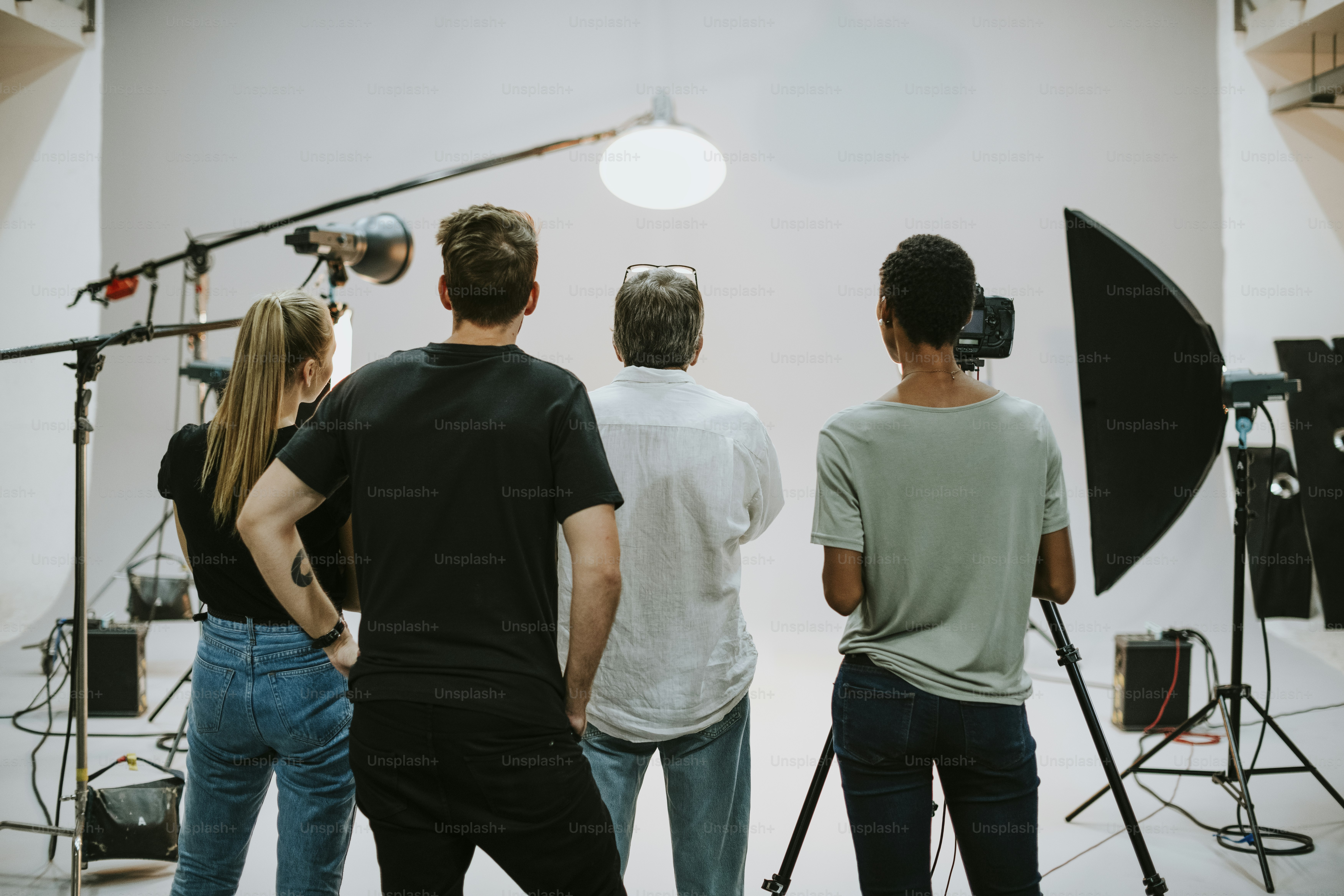 Production team working together in a studio photo – Photography Image ...