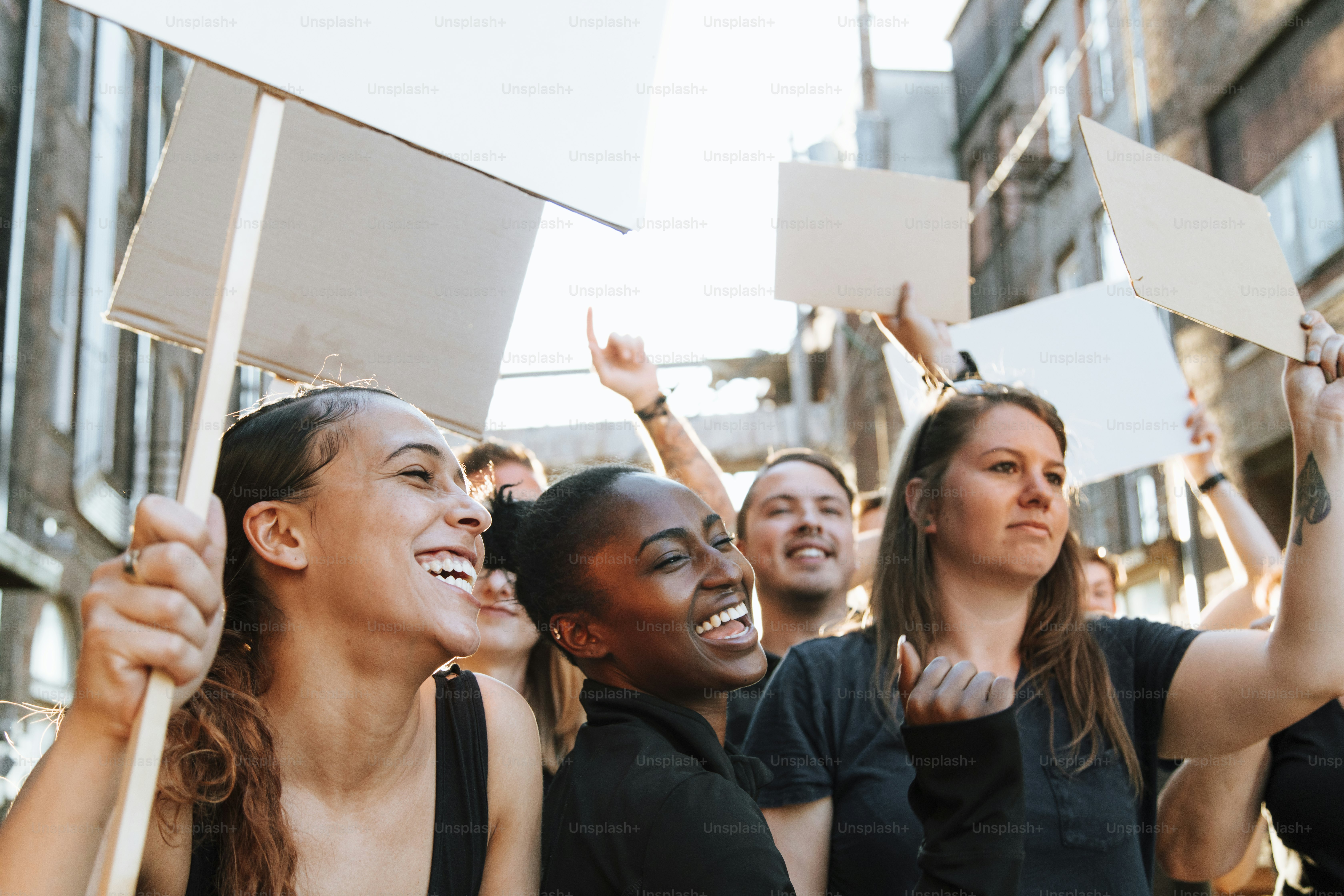 Ecstatic protesters marching through the city photo – Community Image ...