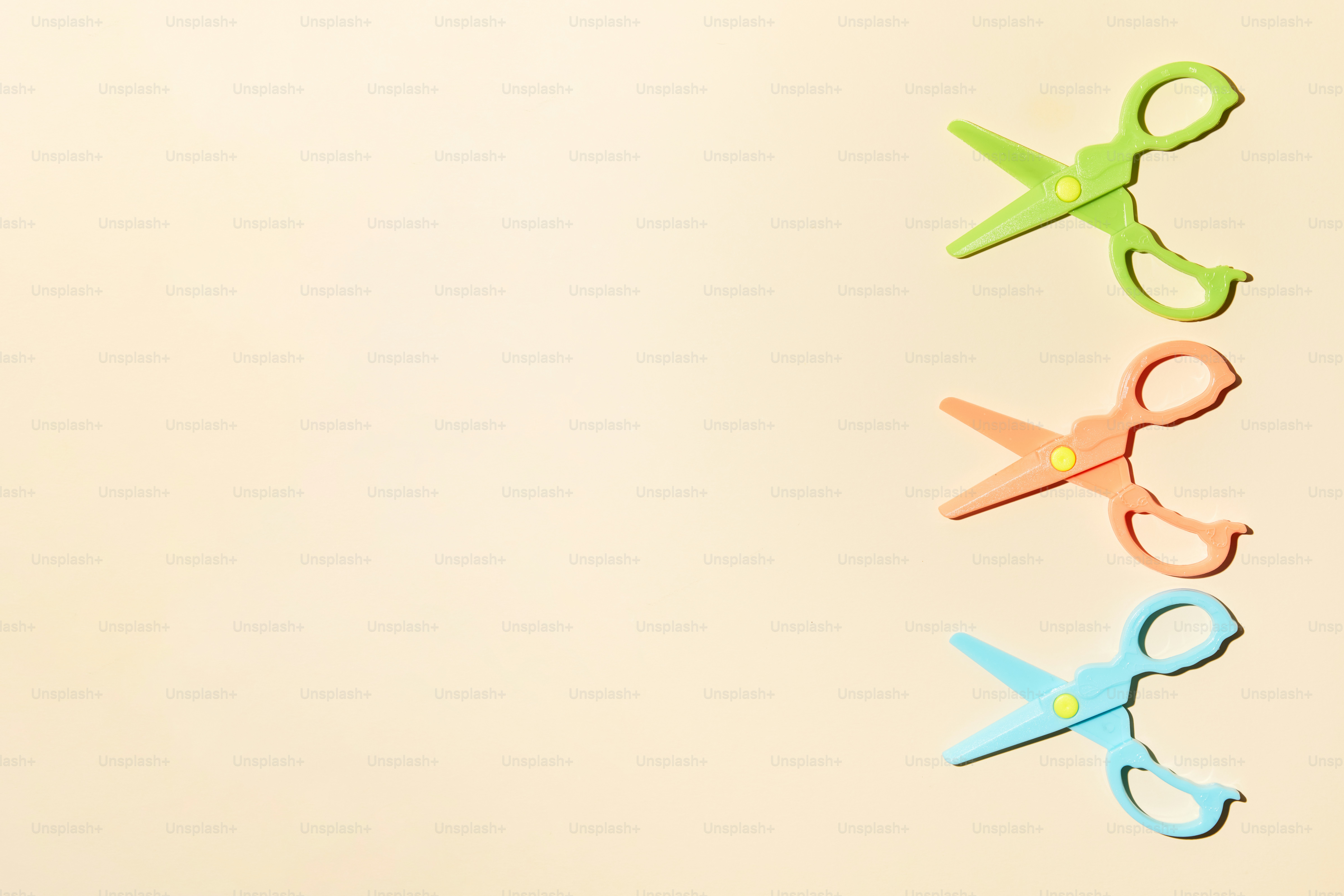 A group of scissors sitting on top of a table photo – Scissors Image on ...