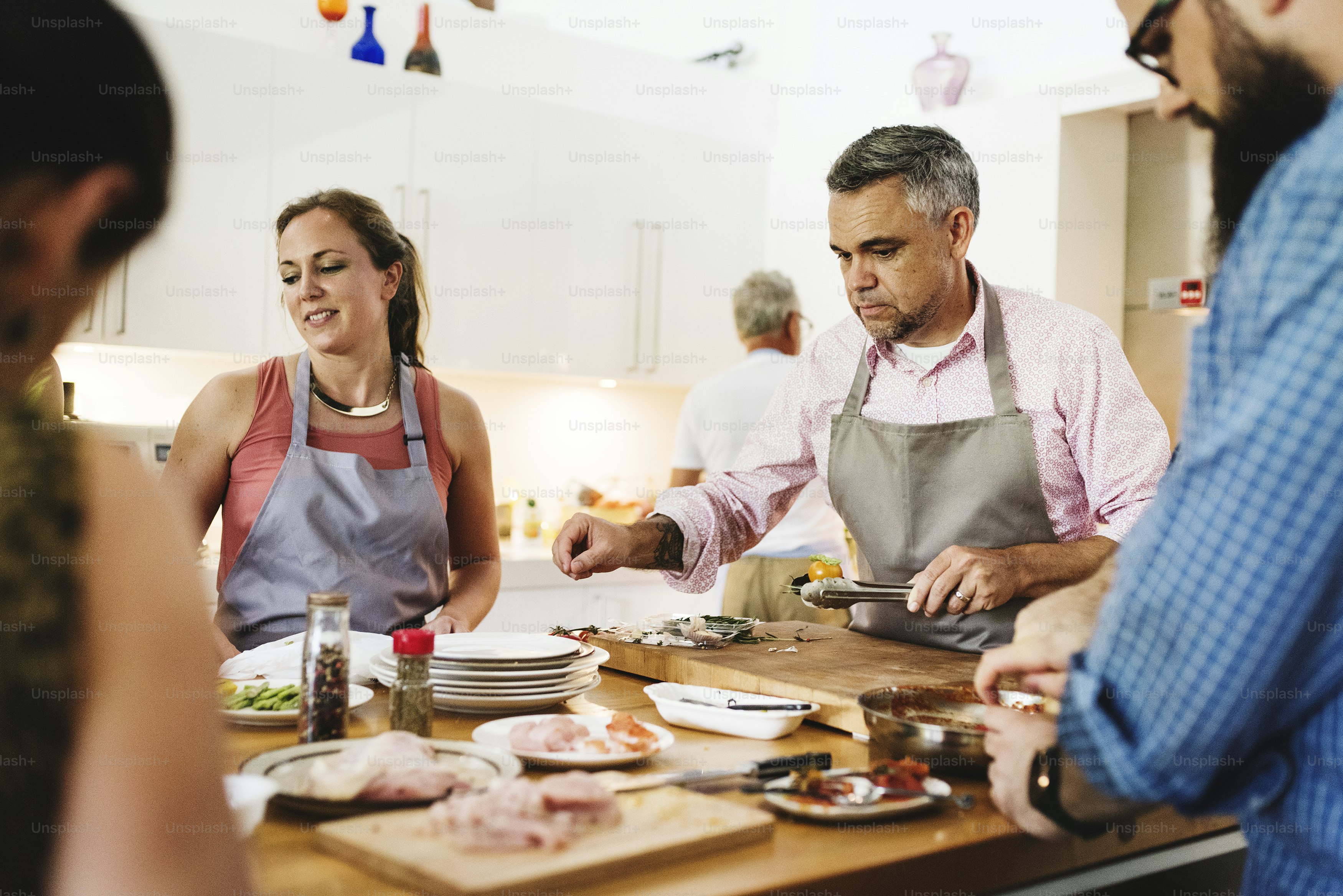 Group of friends are cooking in the kitchen photo – Adults only Image ...