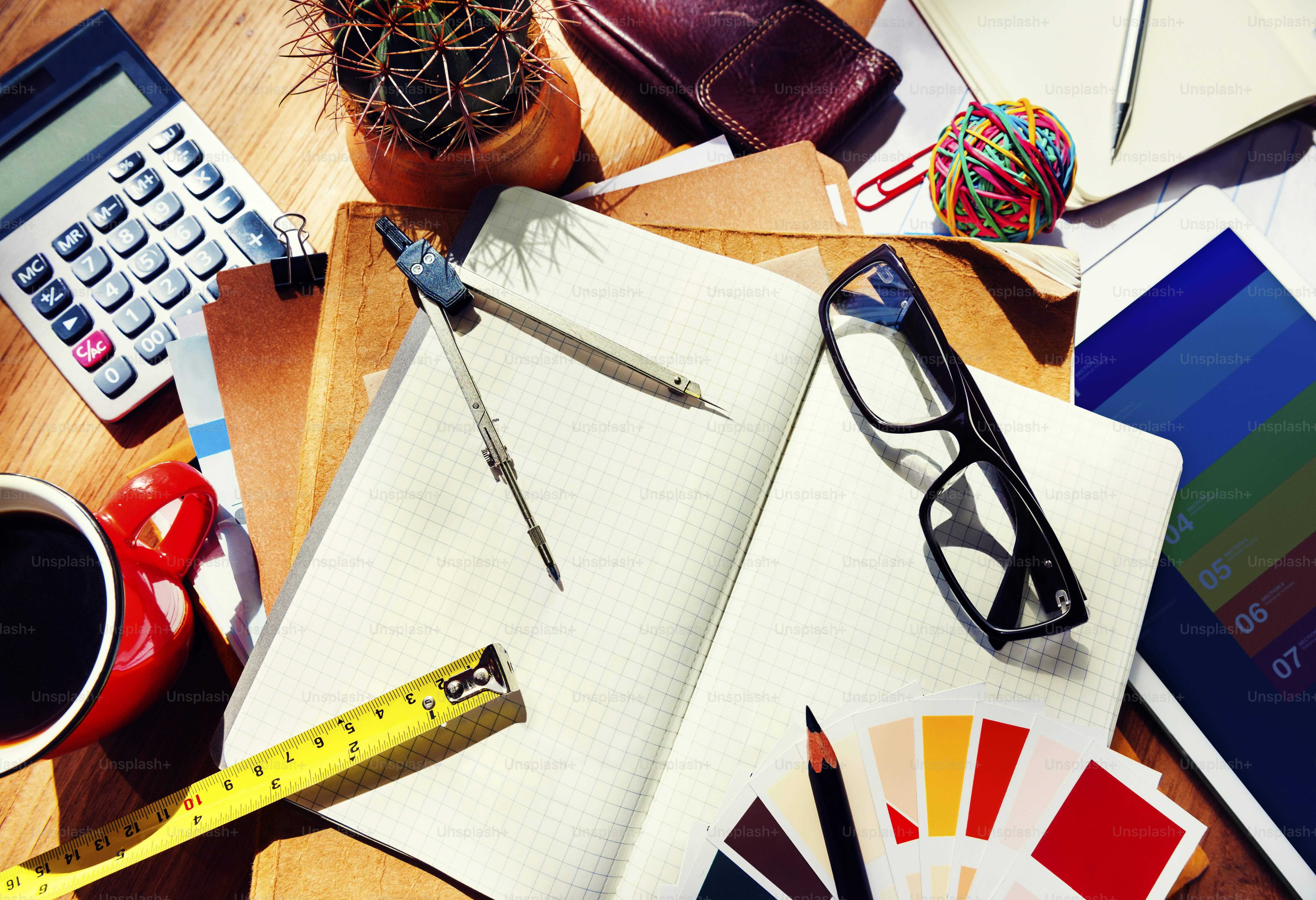 Messy Designer Table Office Supply Concept photo – Cluttered Image on ...