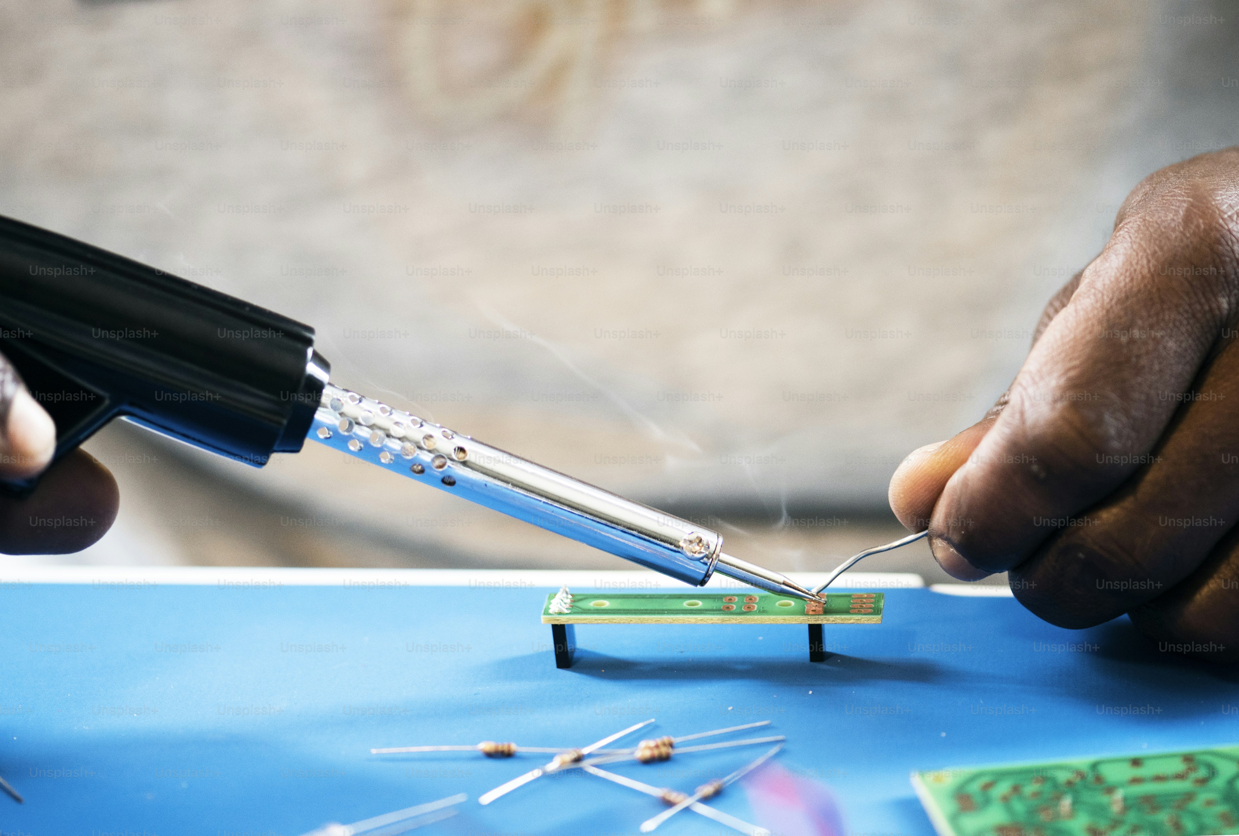 Closeup of tin soldering with electronics circuit board photo ...