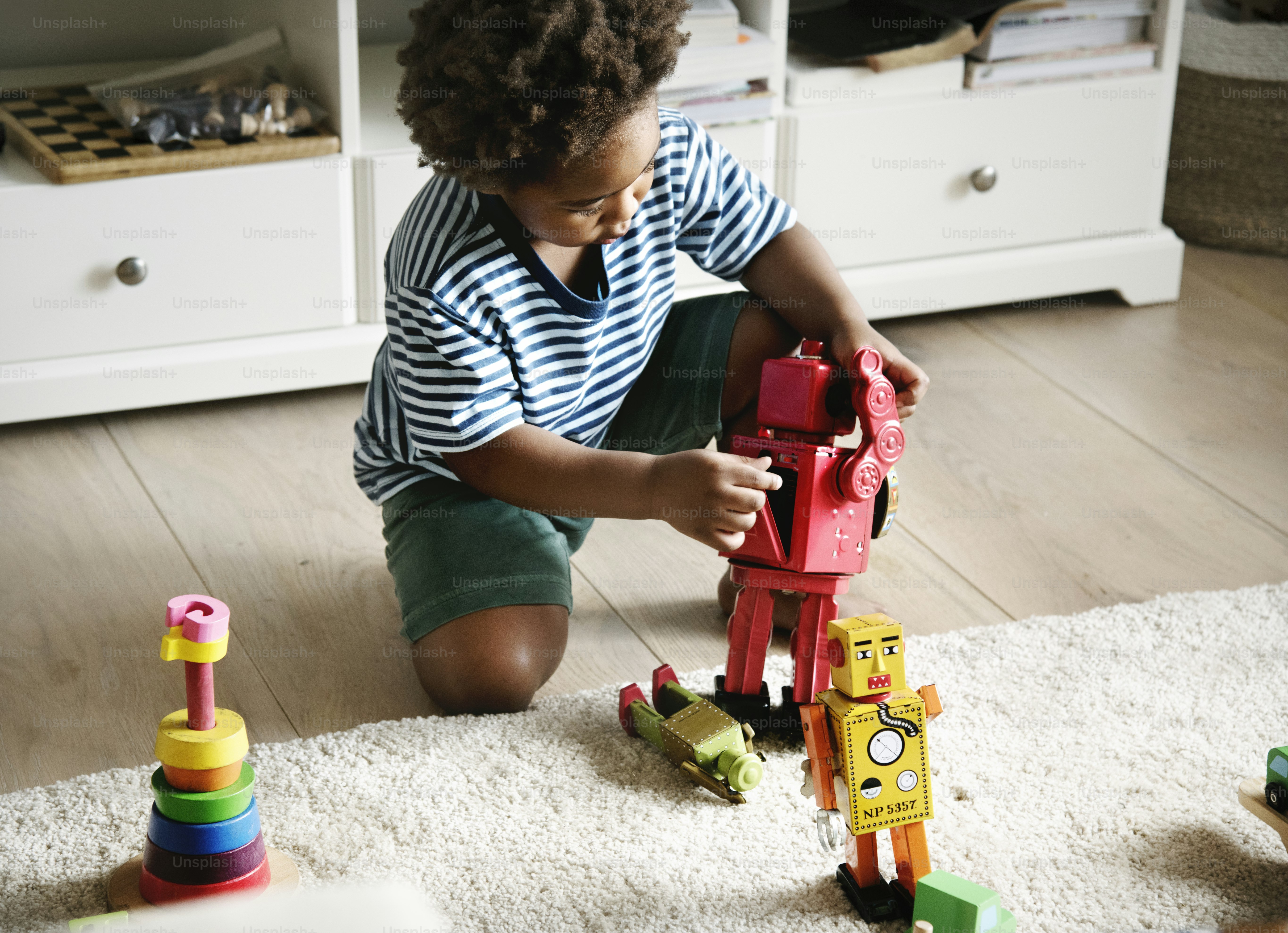 Black boy playing robot at home photo – African ethnicity Image on Unsplash