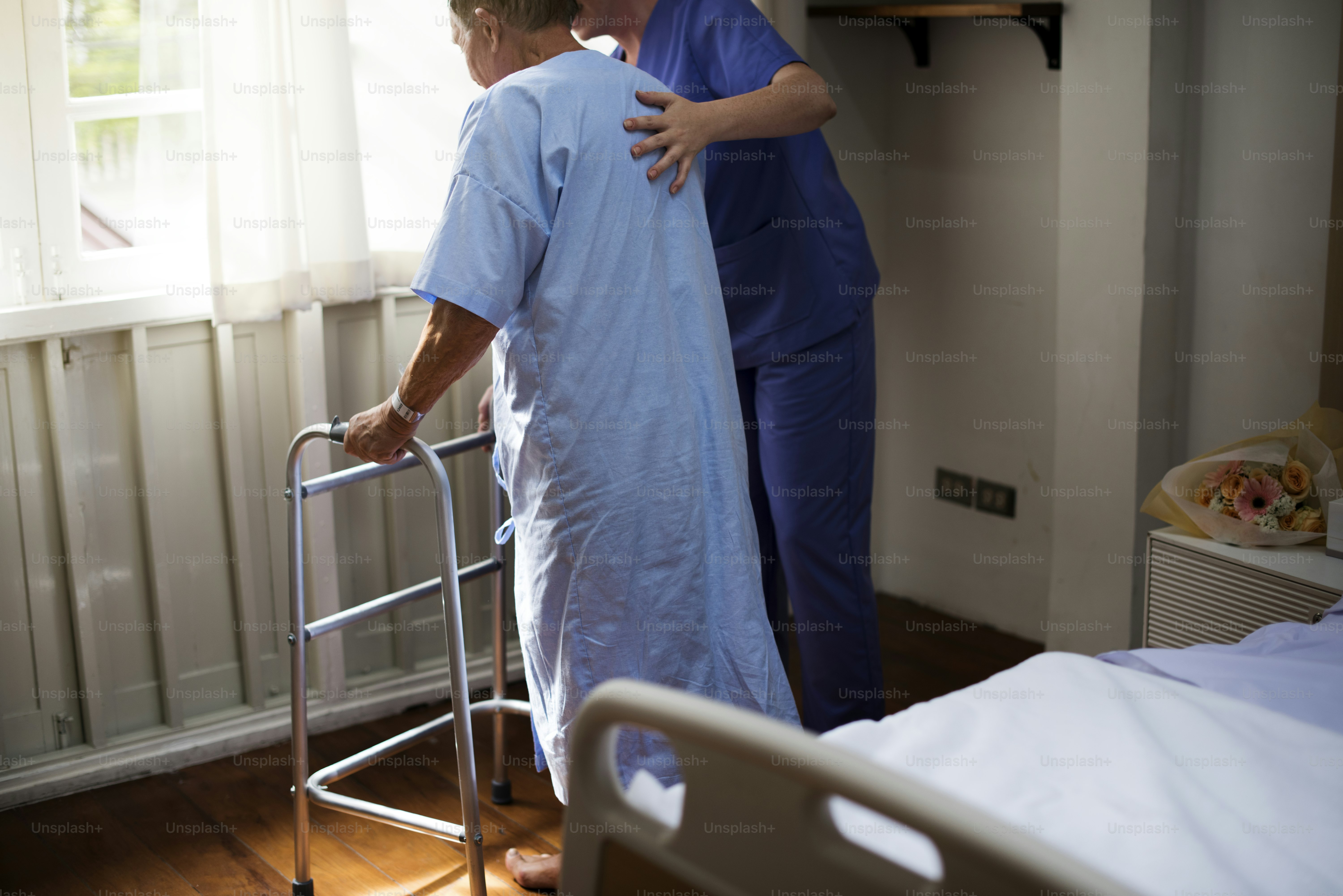 An elderly man using walker photo – Hospital Image on Unsplash