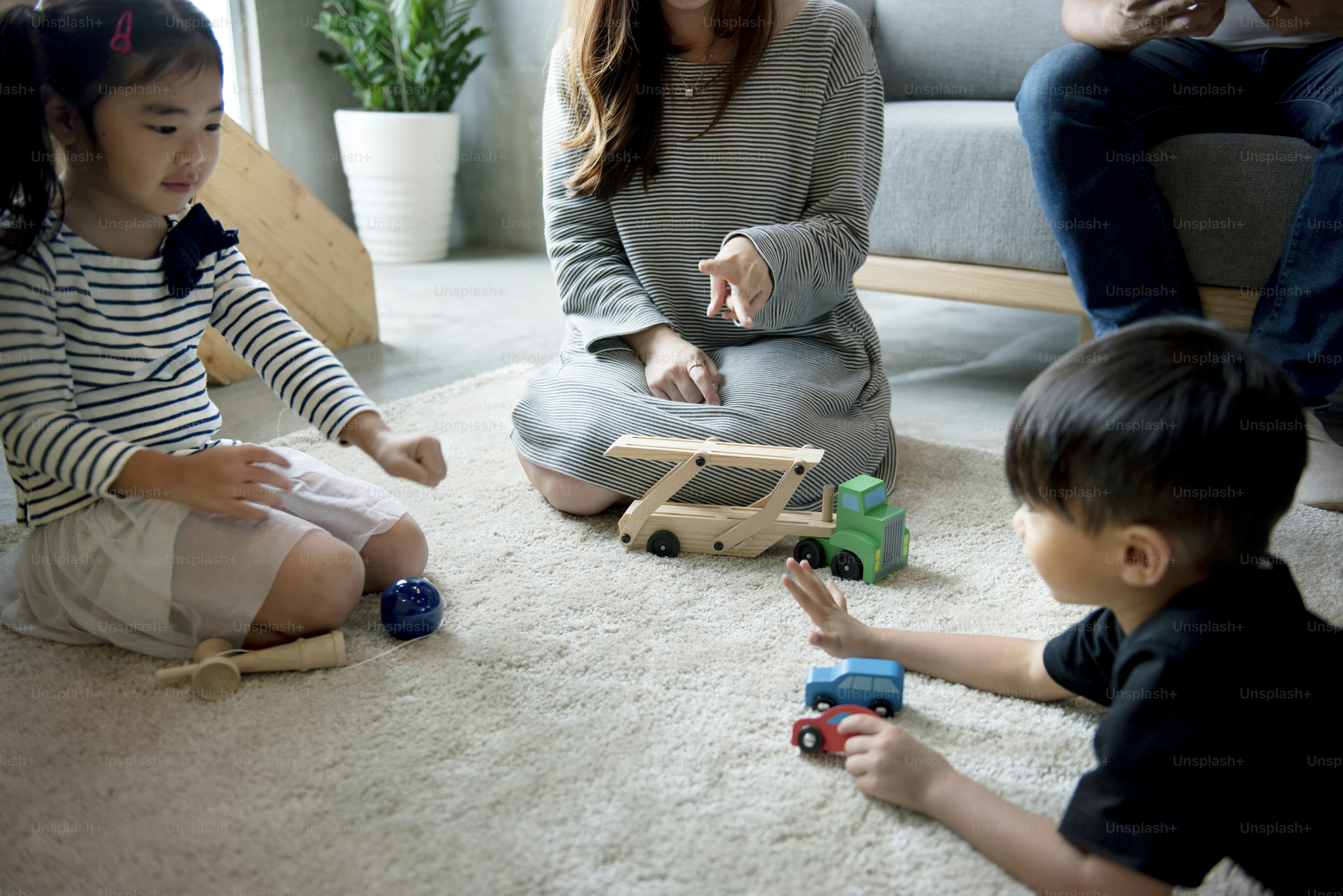 Family spenting time together at home photo – Recreational pursuit ...