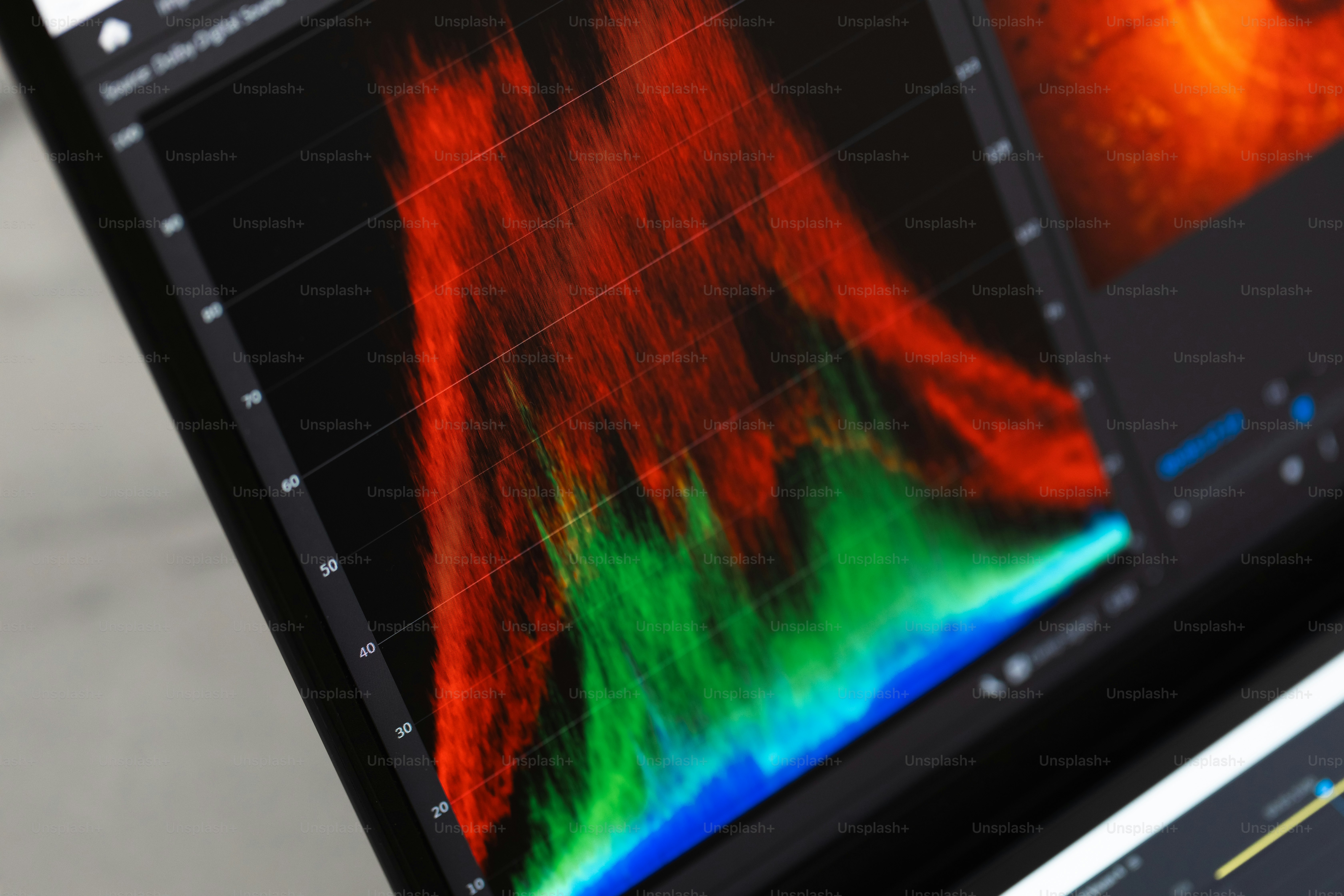 A close up of a computer screen with sound waves on it photo – Colour ...