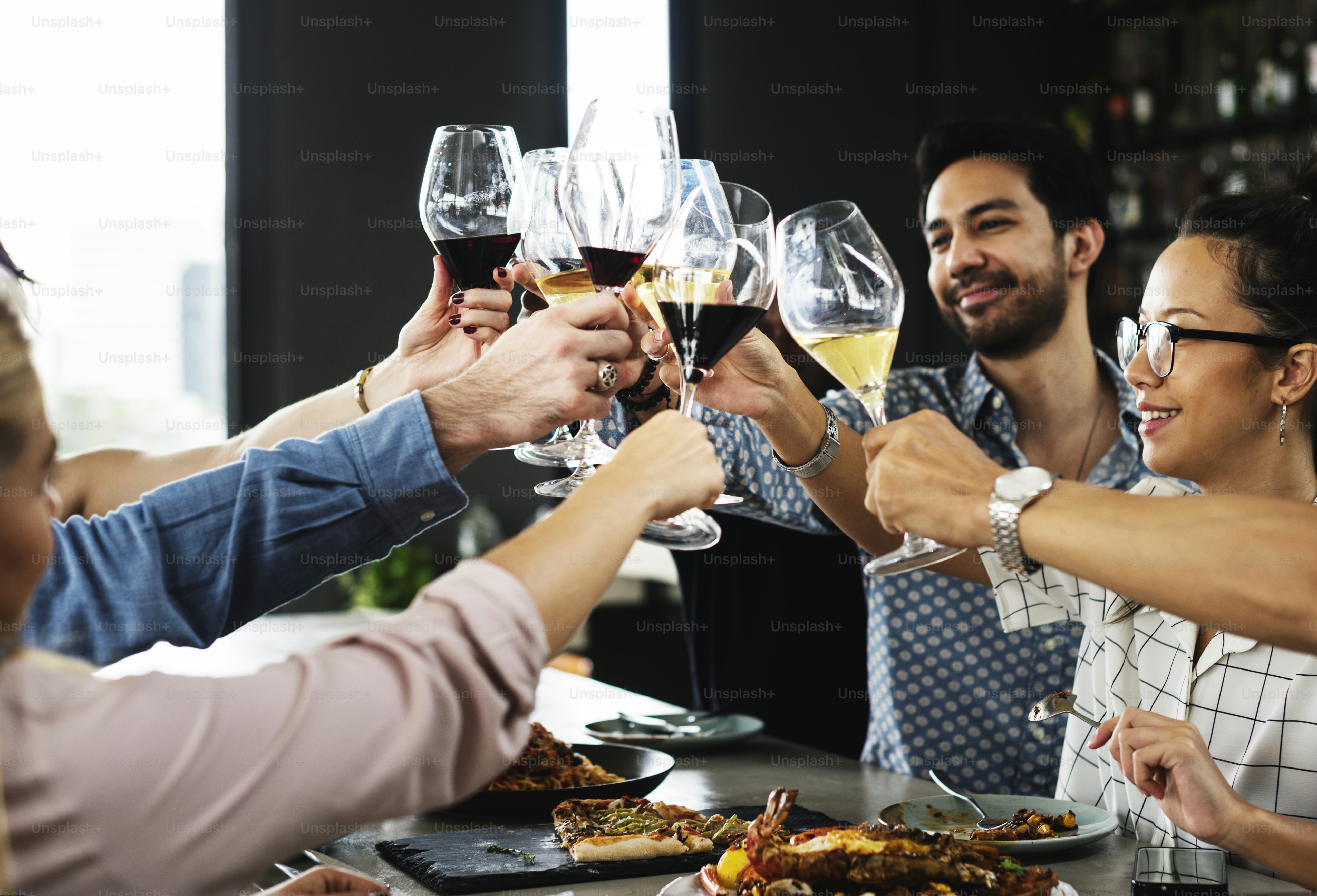 People having meal together in the restaurant photo – People Image on ...