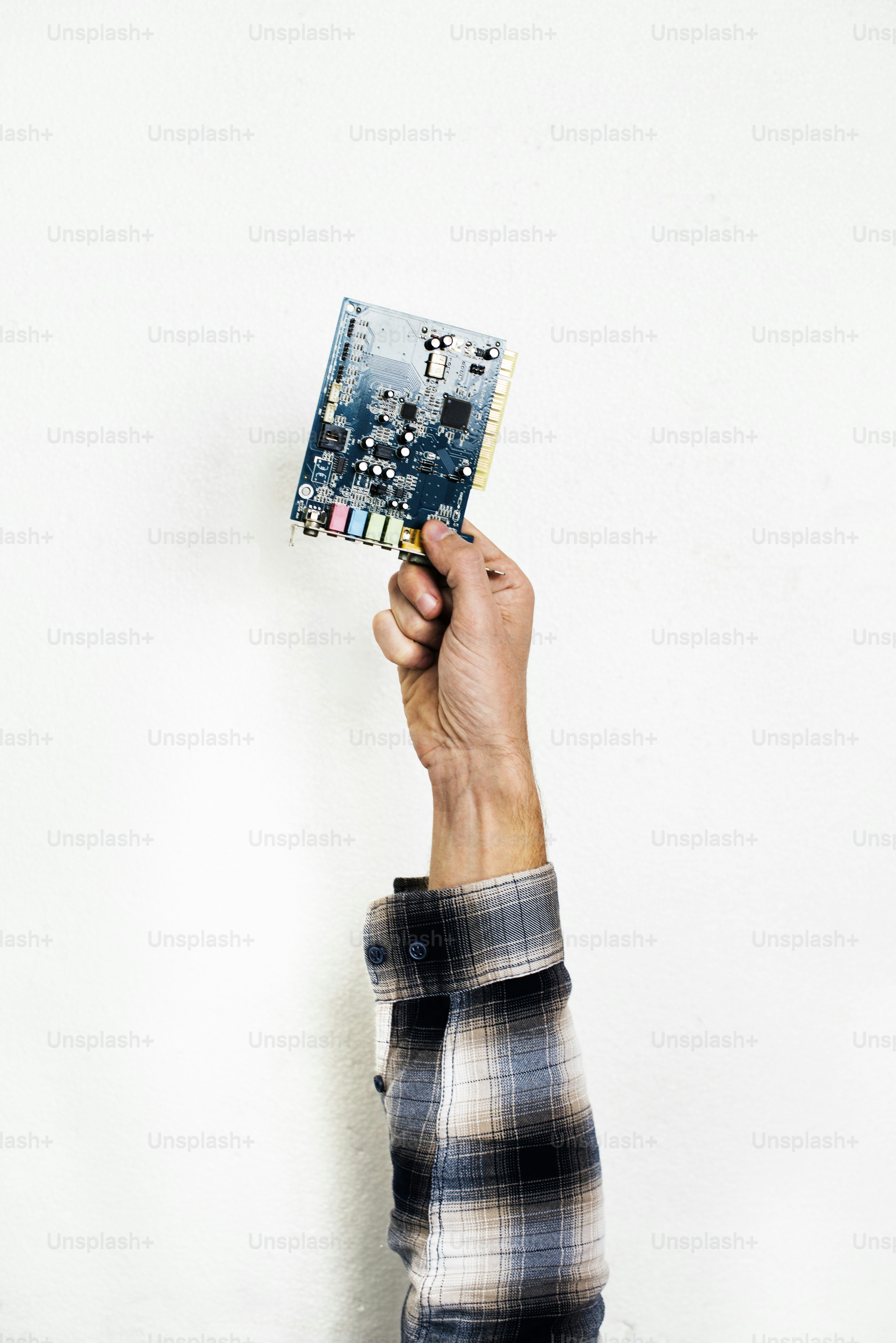 Hand holding computer motherboard isolated on white photo – Electrical ...