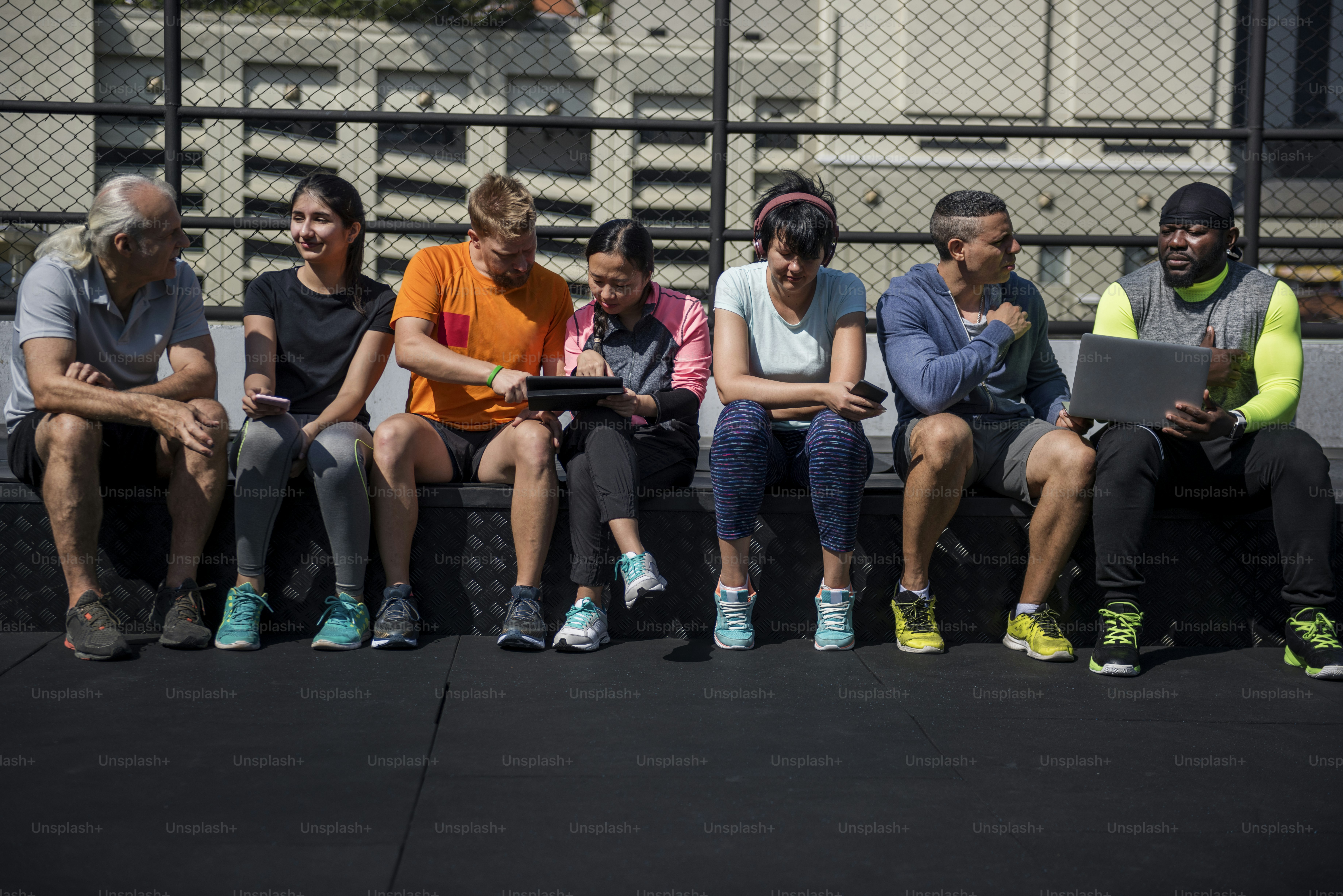 Group of diverse people using digital devices photo – Active lifestyle ...