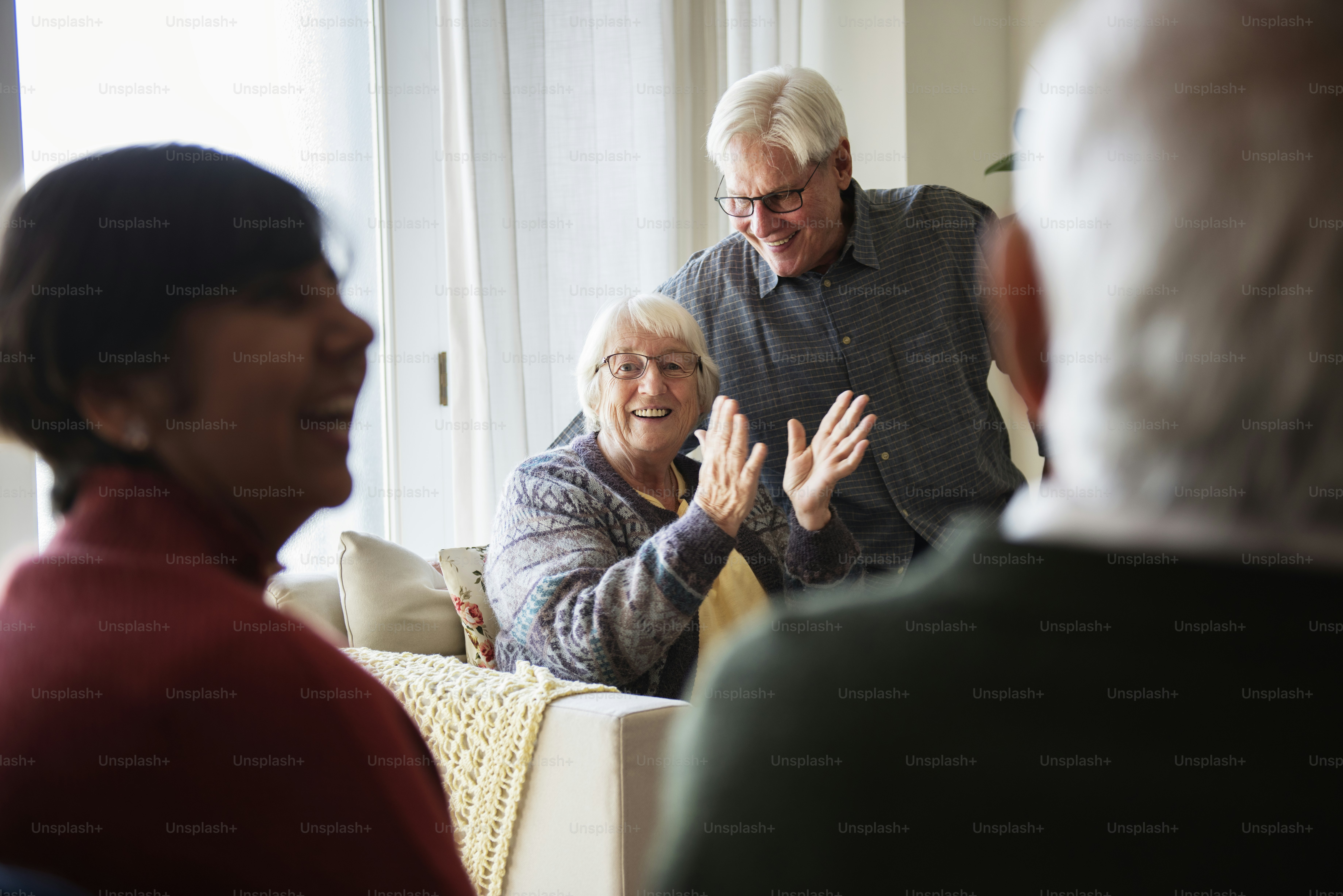 Senior people talking in a living room photo – Retirement community ...