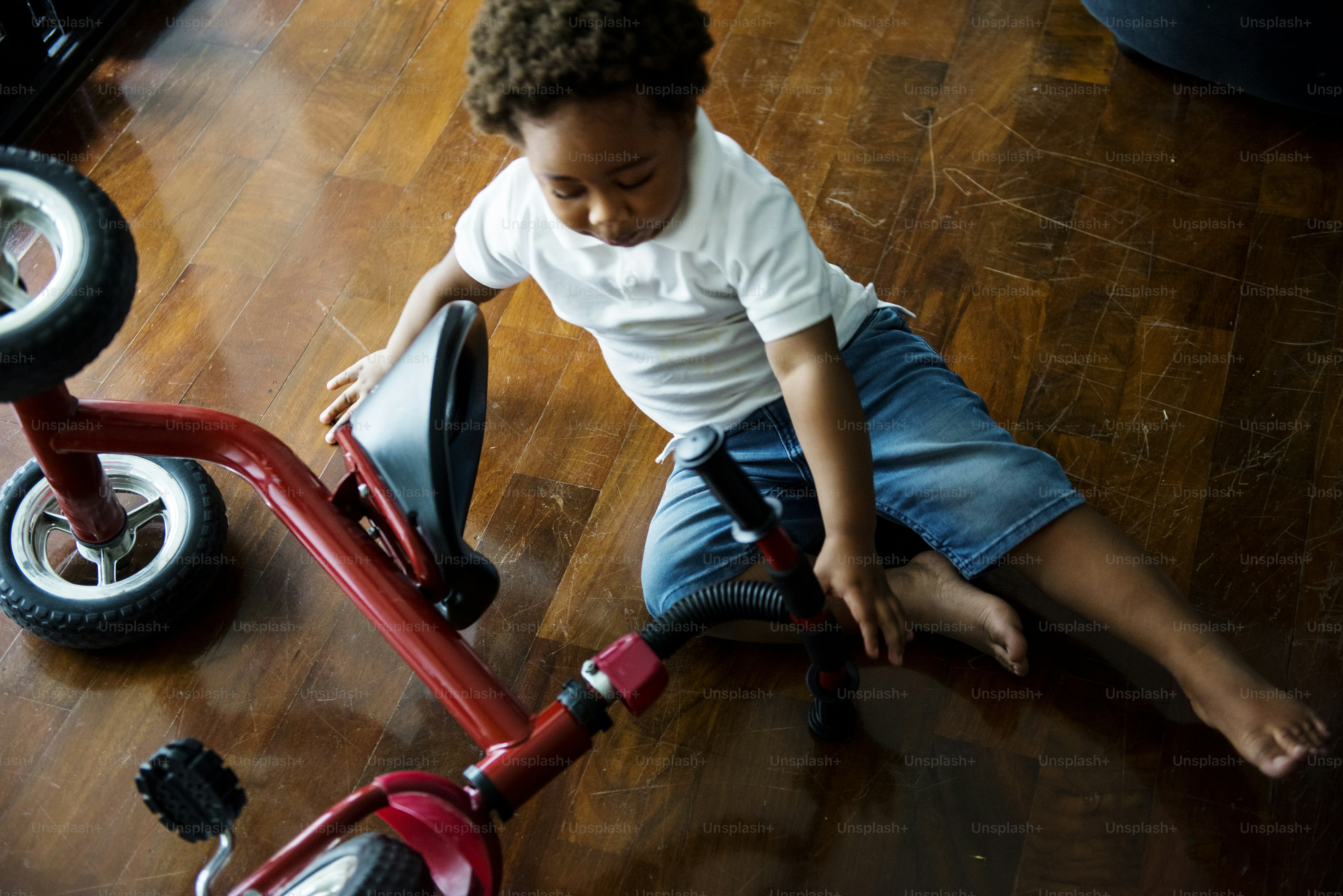 Black kid fell off the bicycle photo – African ethnicity Image on Unsplash