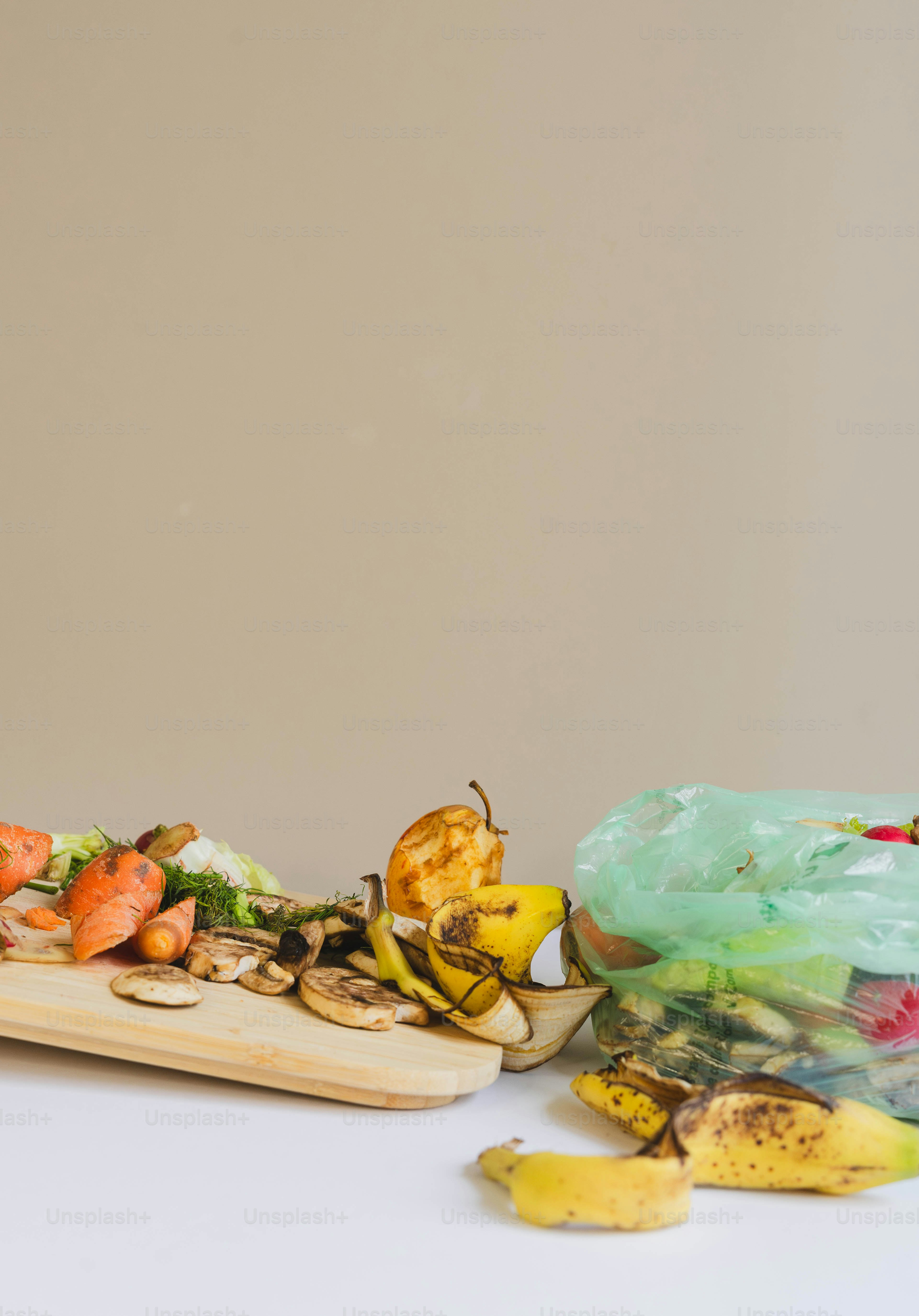 A pile of vegetables sitting on top of a wooden cutting board photo ...