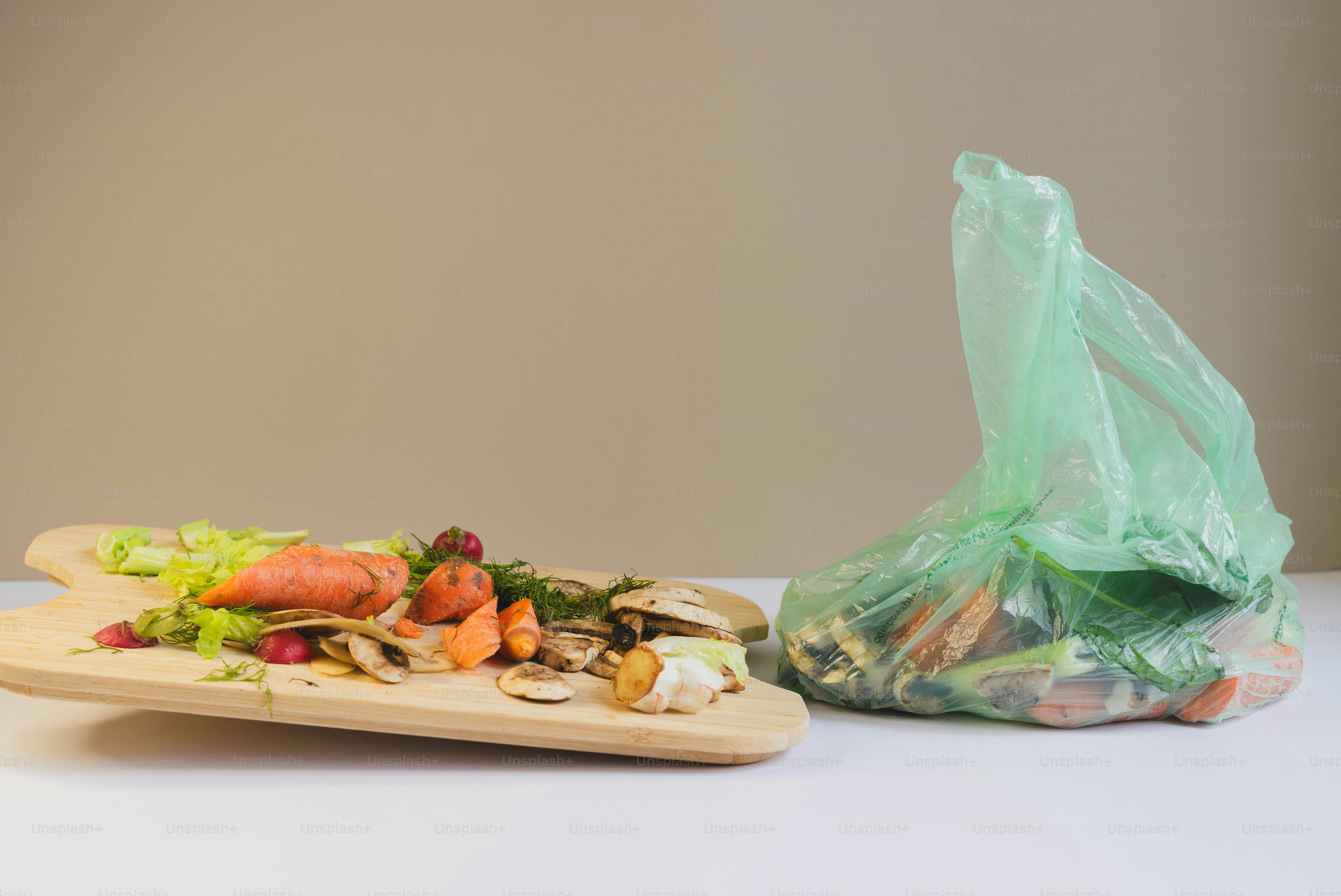 A plate of food and a plastic bag on a table photo – Zero waste Image ...