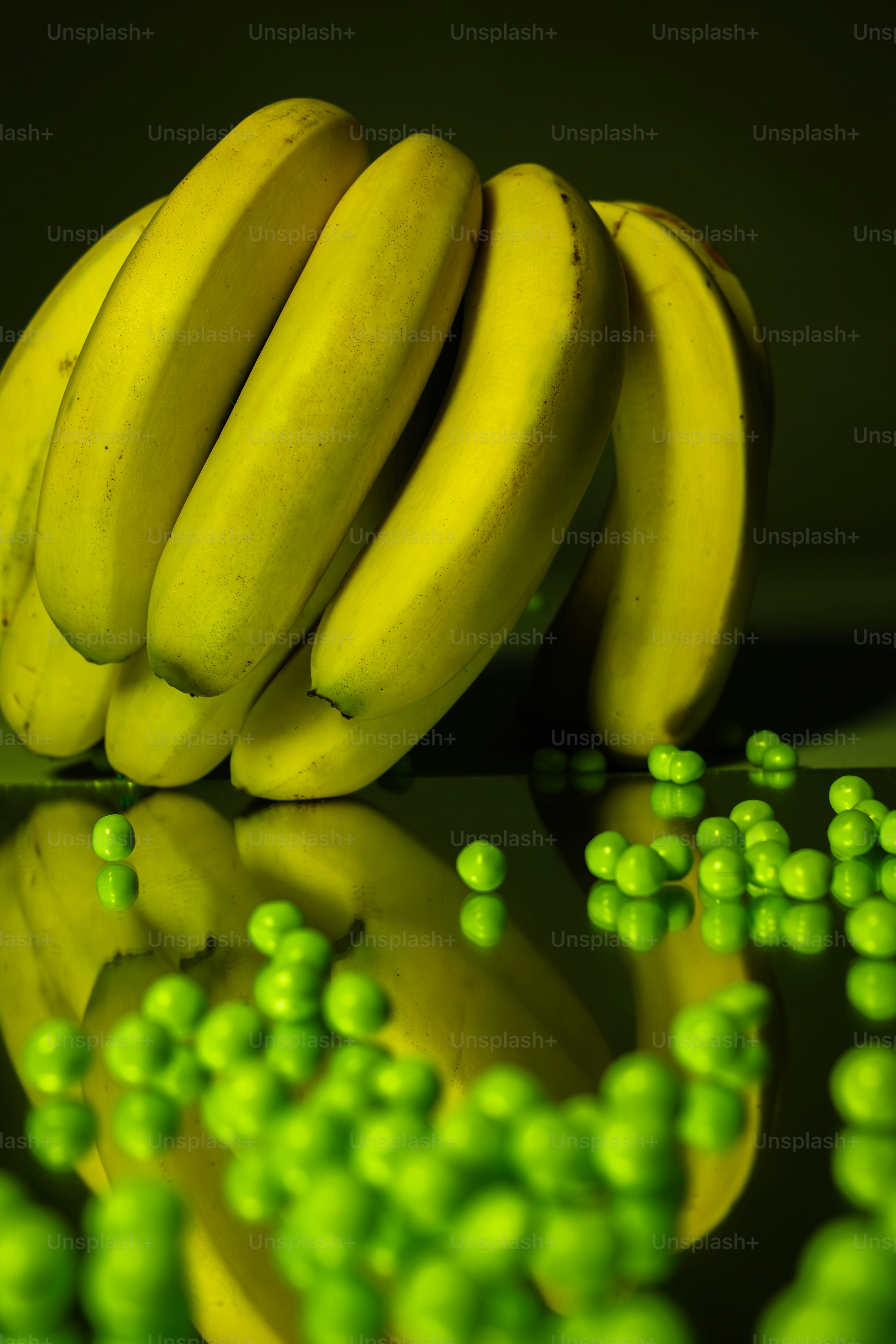 A bunch of bananas sitting on top of a table photo – Brat green Image ...