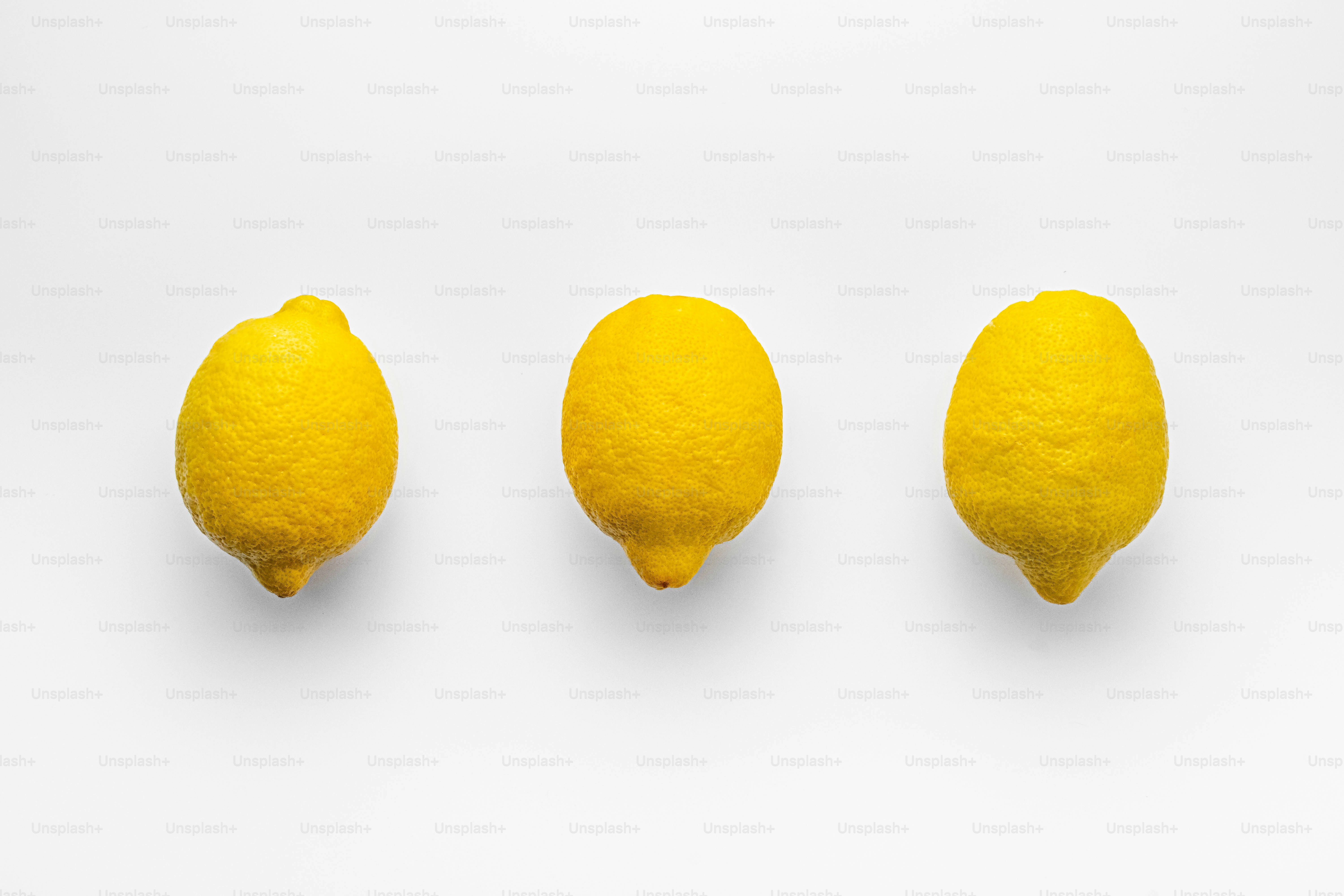 Three lemons in a row on a white background photo – Lemon Image on Unsplash