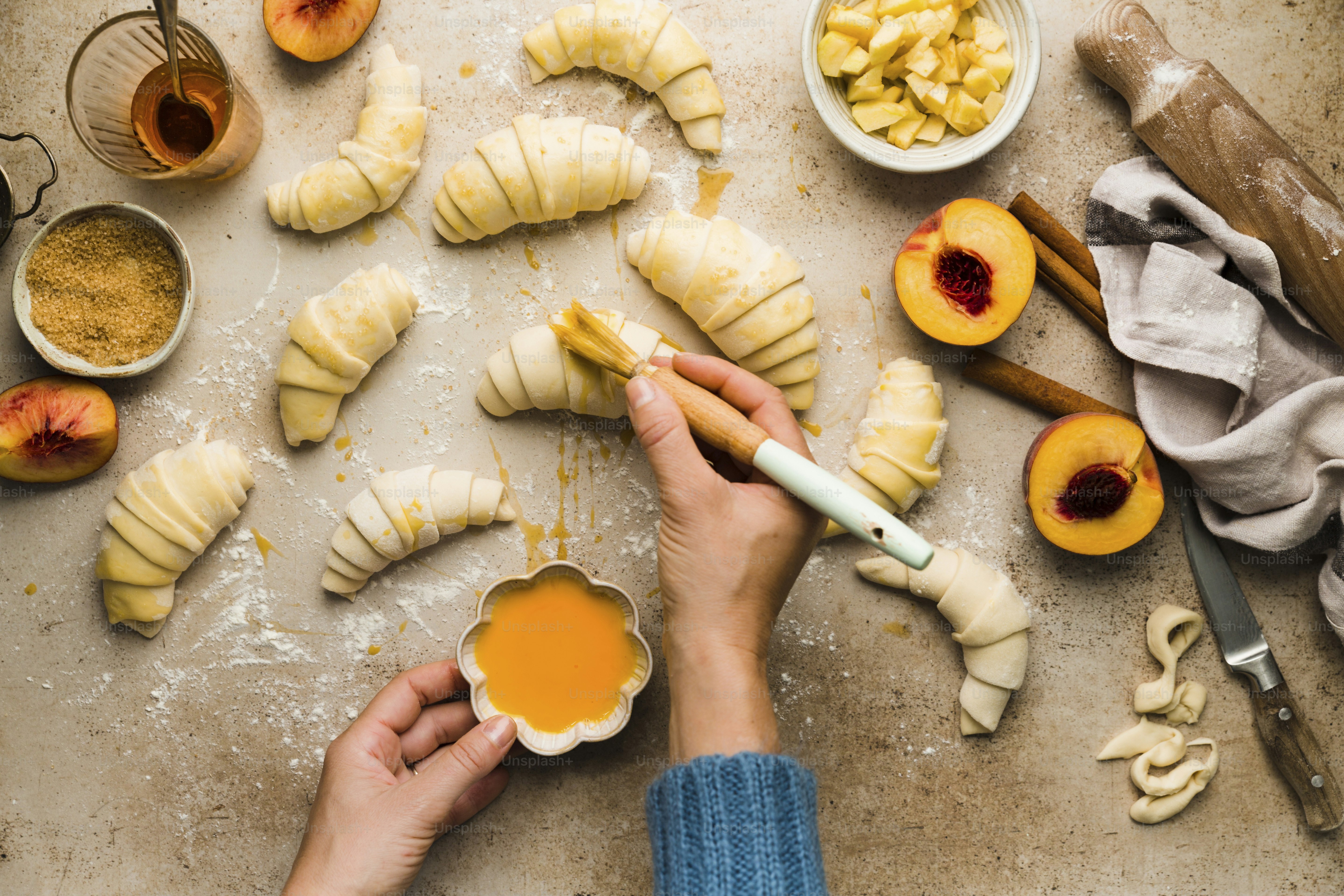 A person is making pastries on a table photo – Cooking Image on Unsplash
