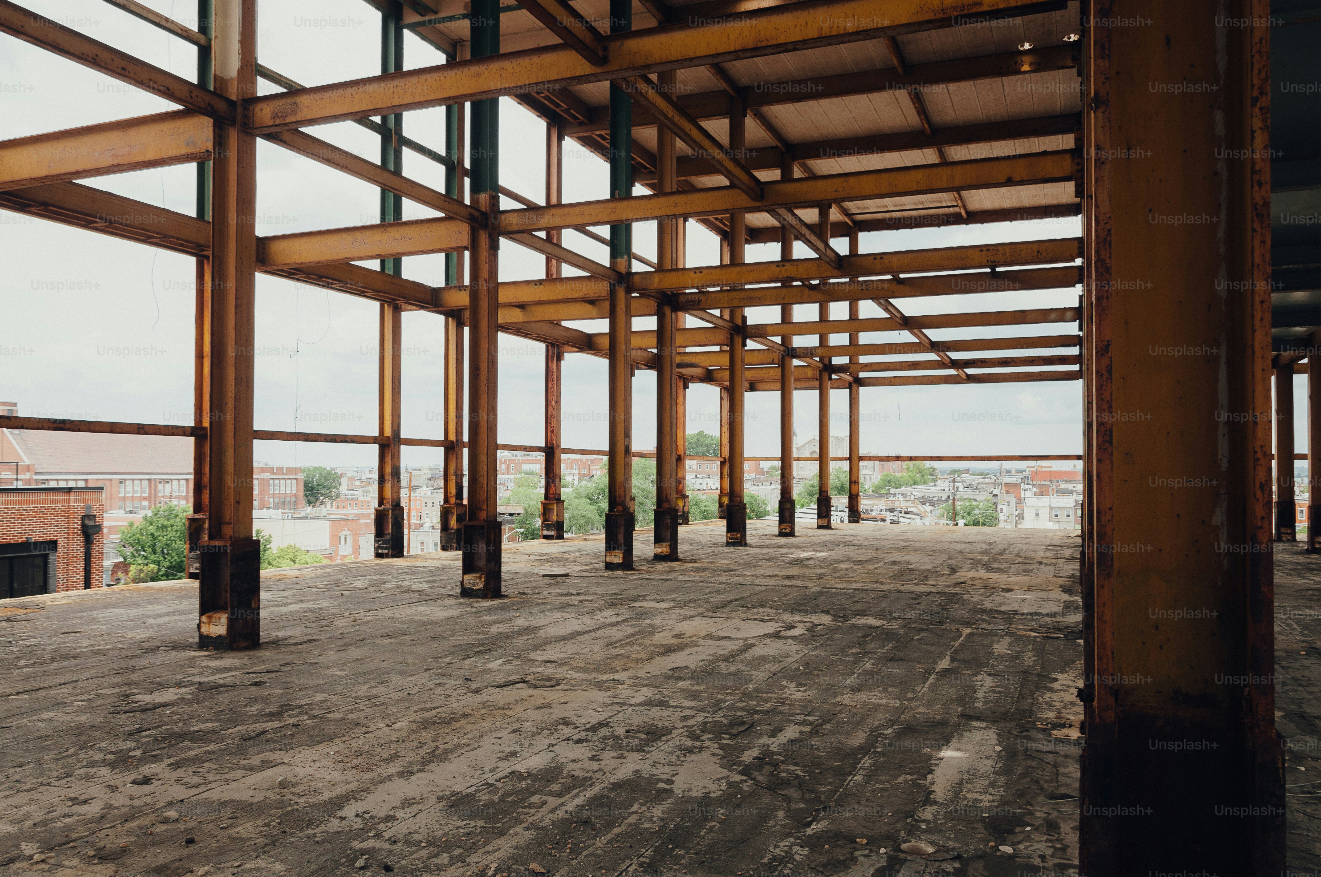 An empty warehouse with wooden beams and a sky background photo ...