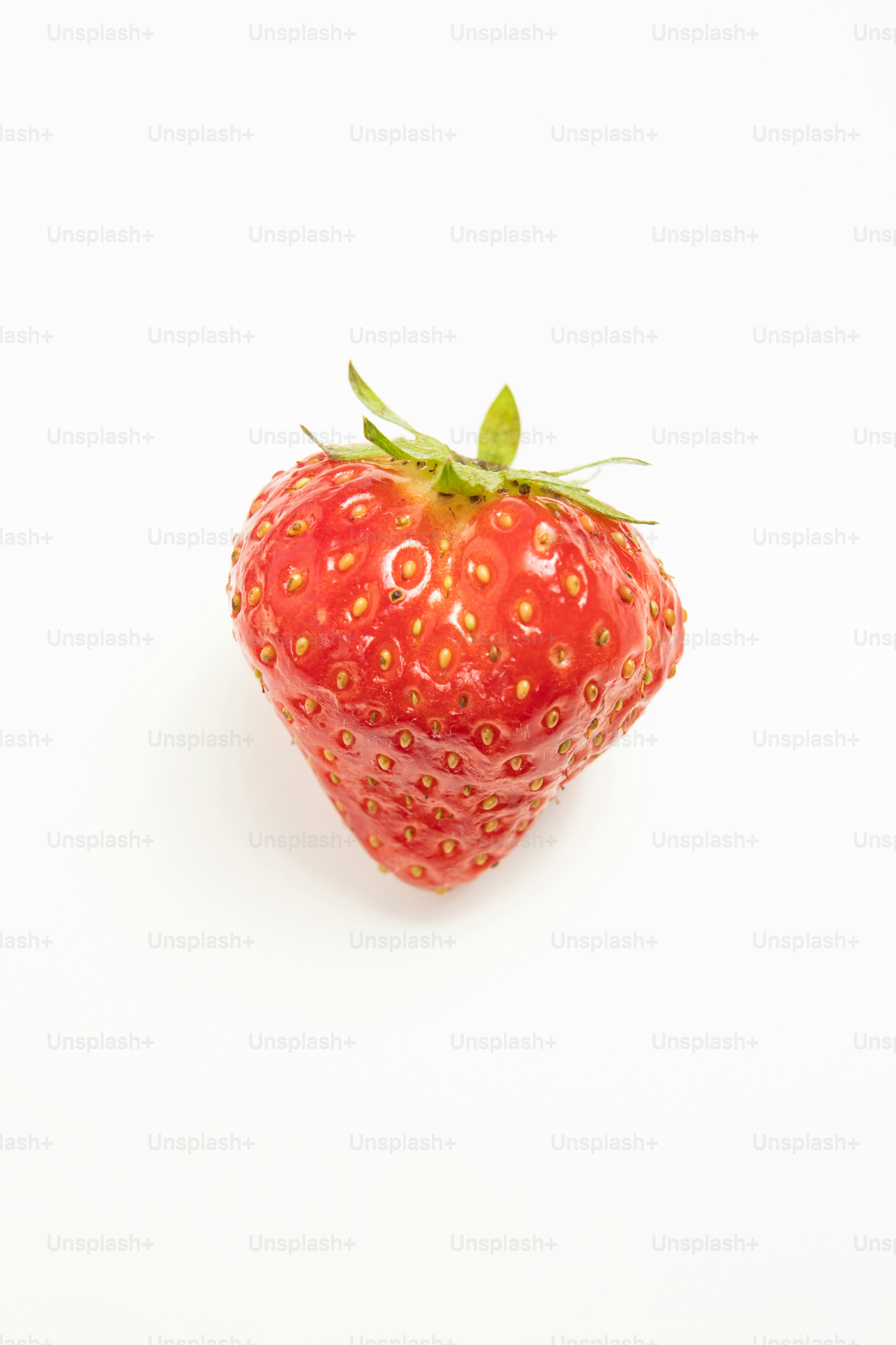 A single strawberry on a white background photo – Summer fruit Image on ...