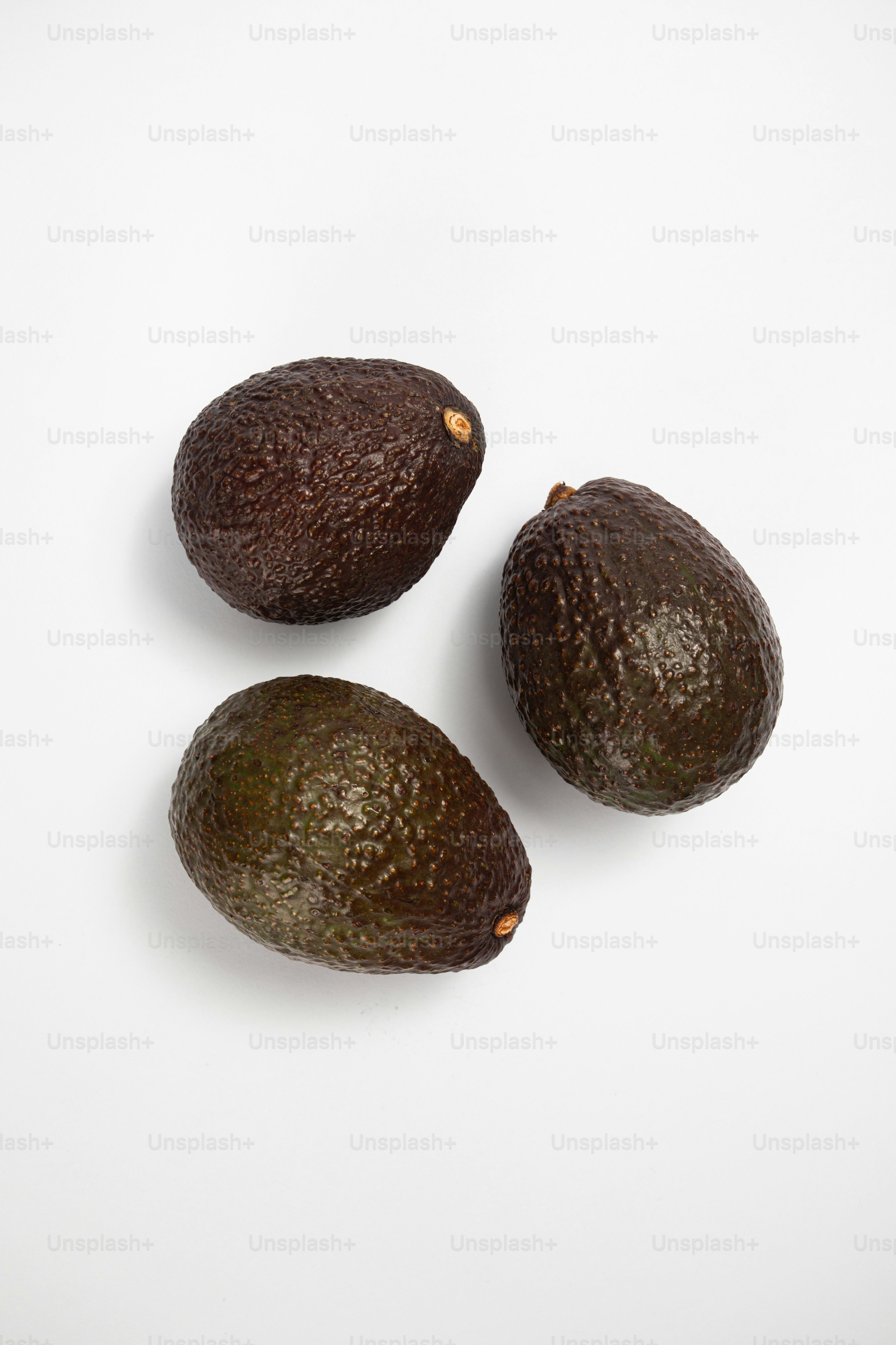 Three avocados on a white background photo – Avocado Image on Unsplash
