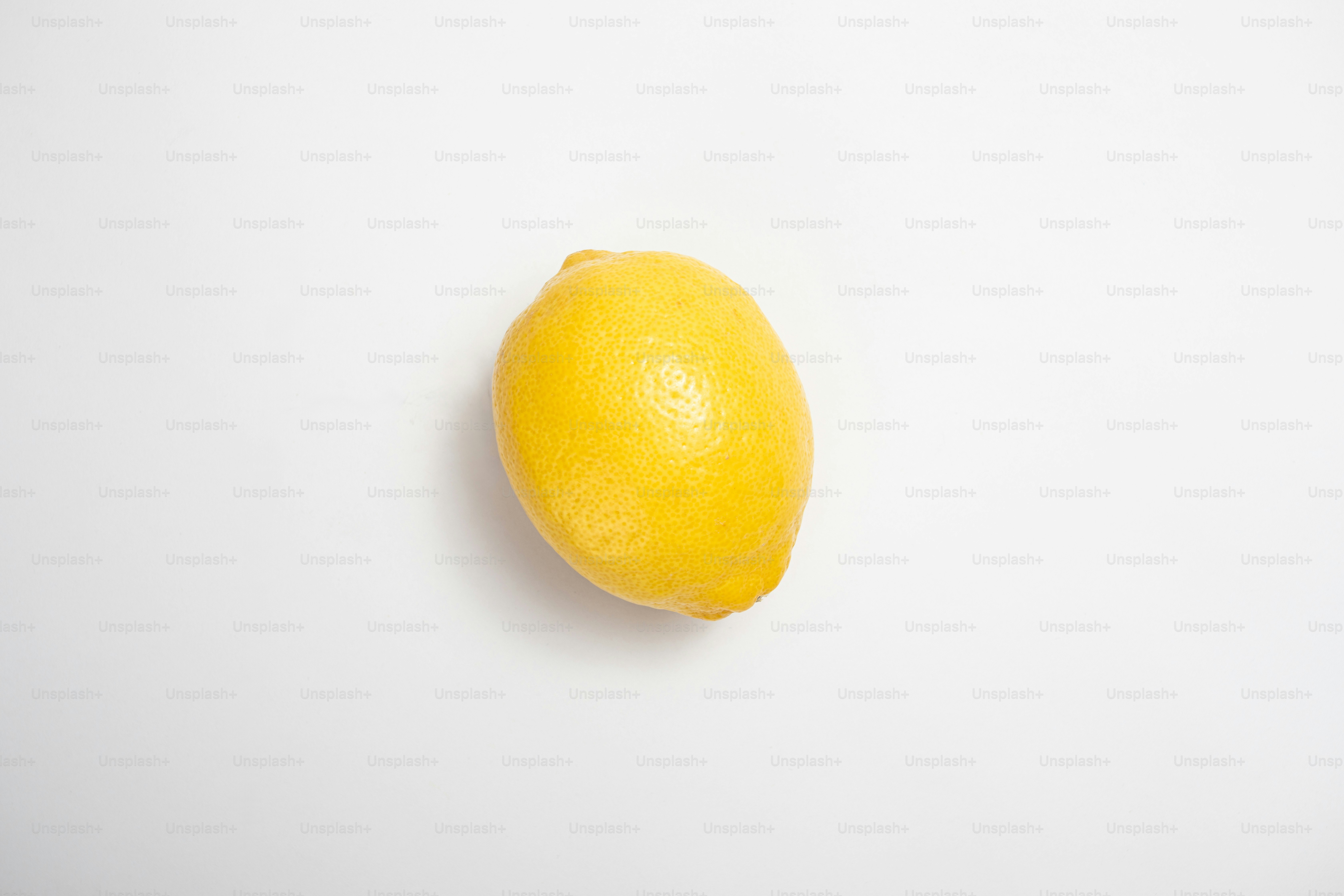 A single lemon on a white background photo – Fresh food Image on Unsplash