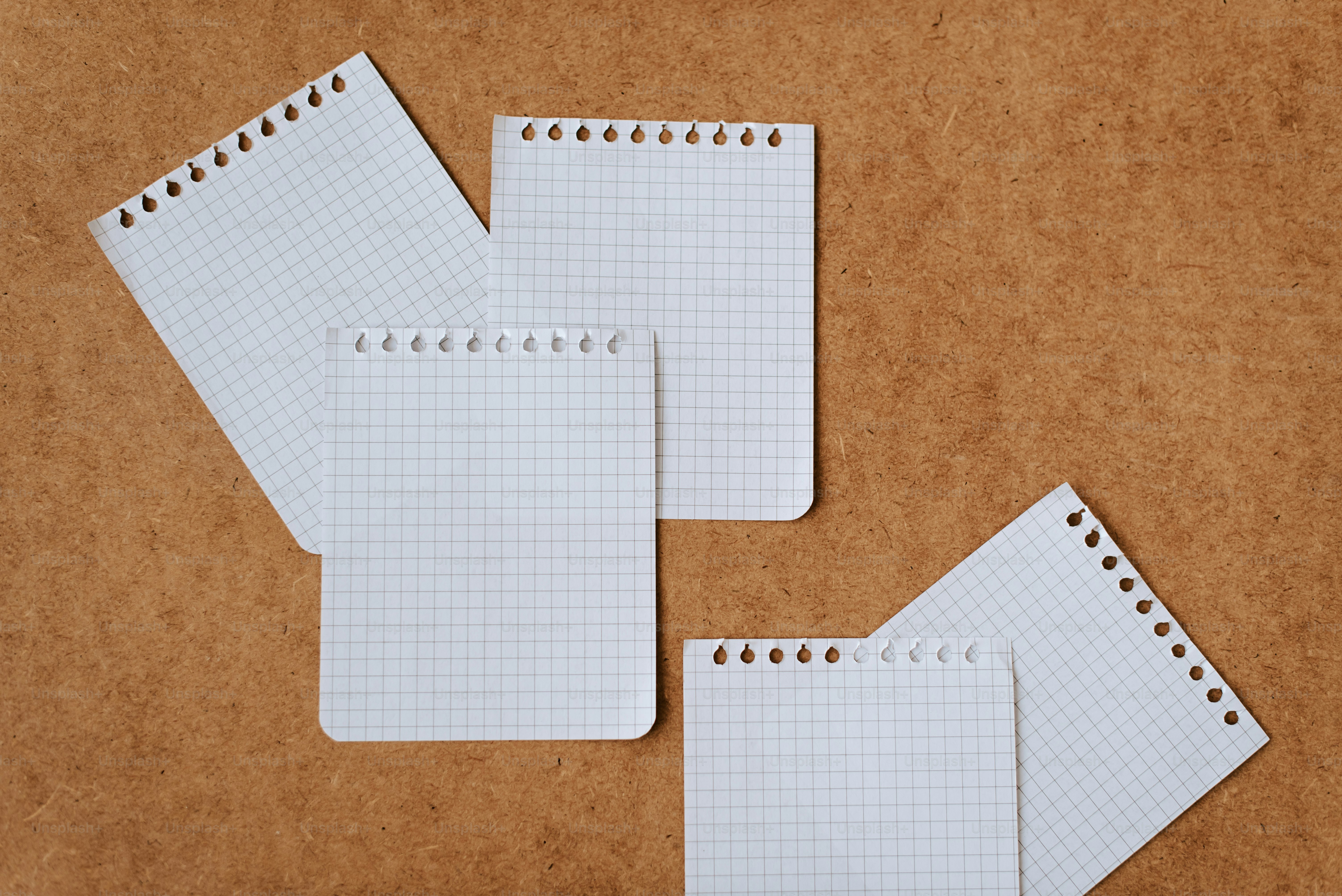 Three blank notepads on a brown surface photo – Paper texture Image on ...