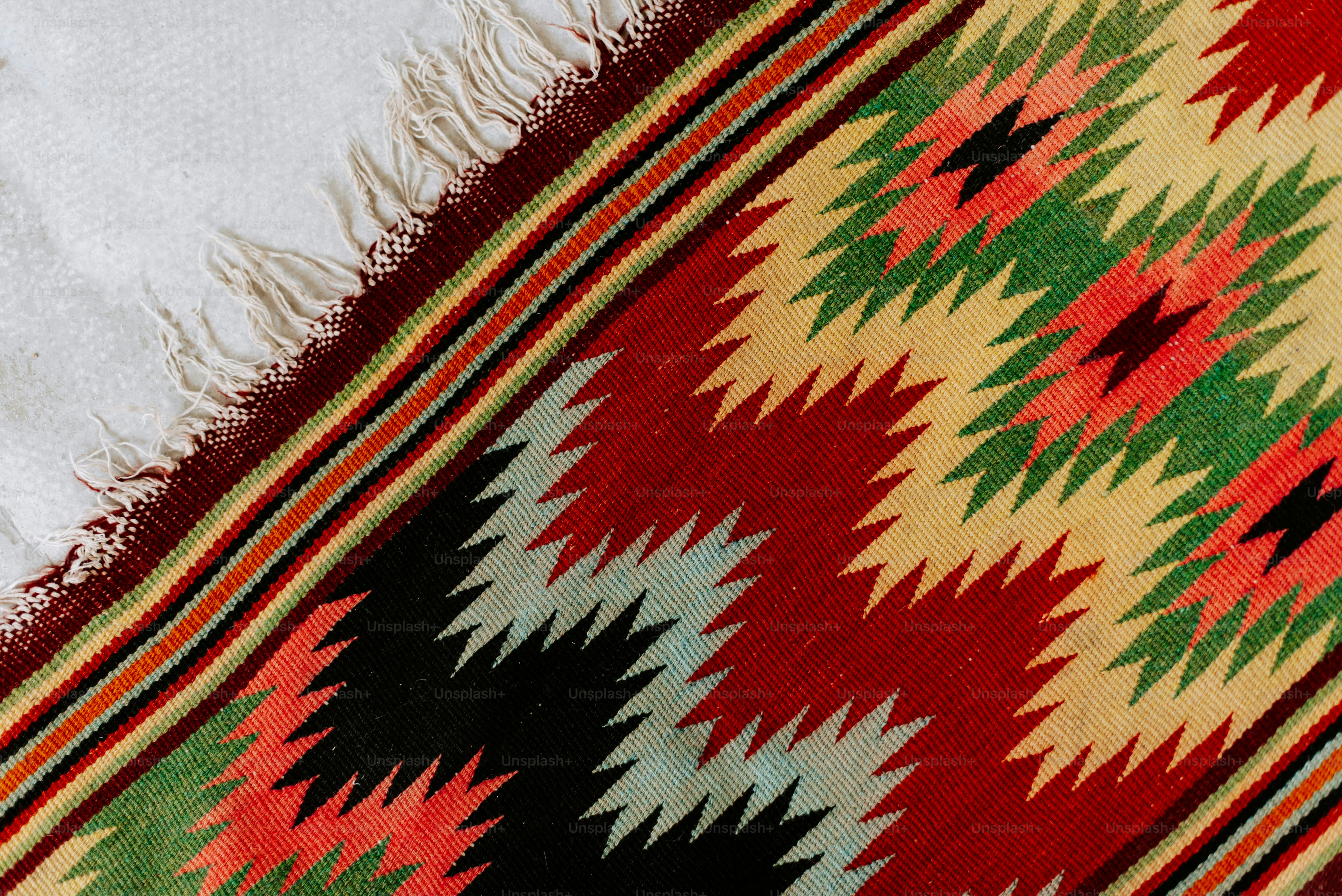 A close up of a colorful rug with fringes photo – Patterns Image on ...