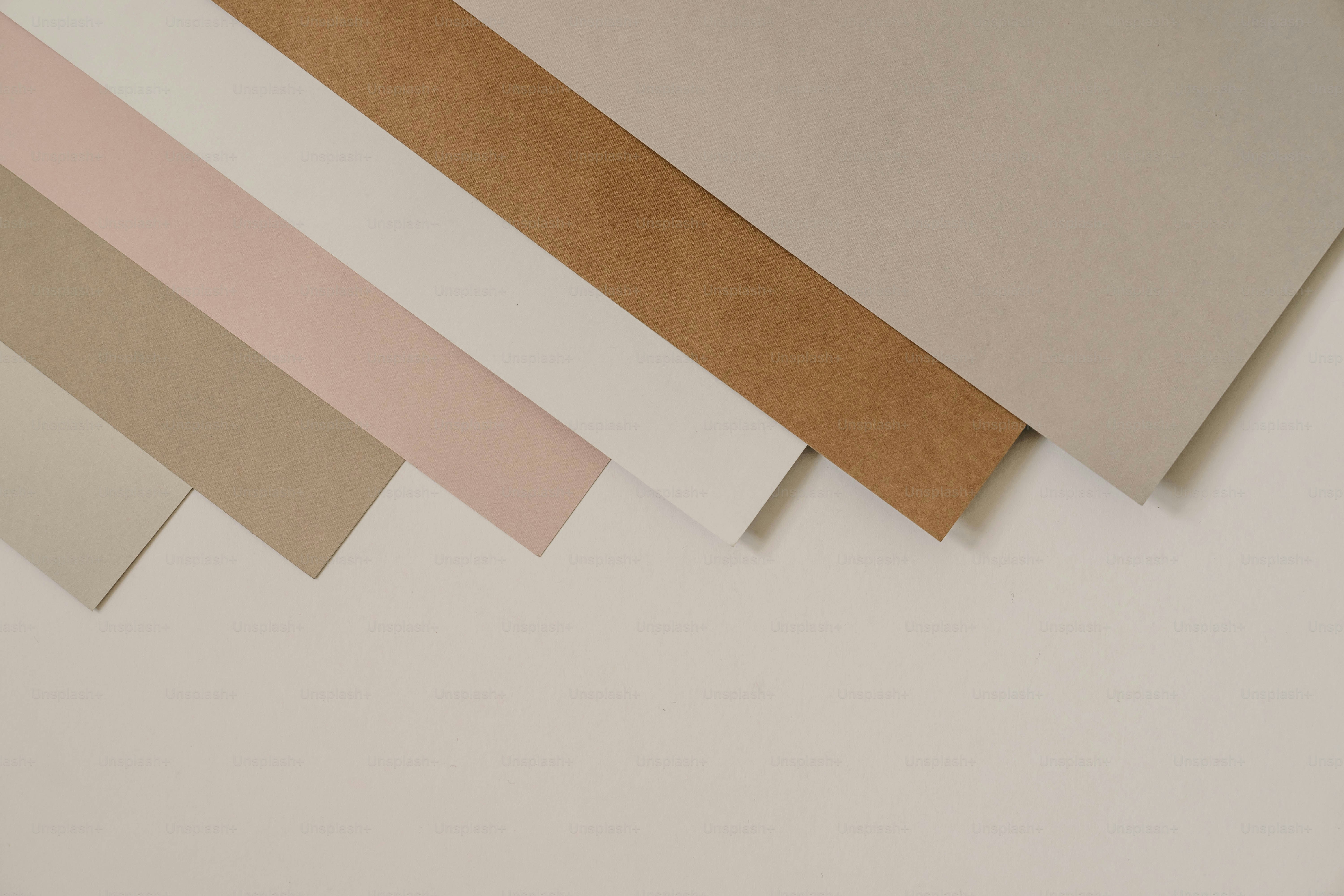 A wall that has some different colors of paper on it photo – Paper ...