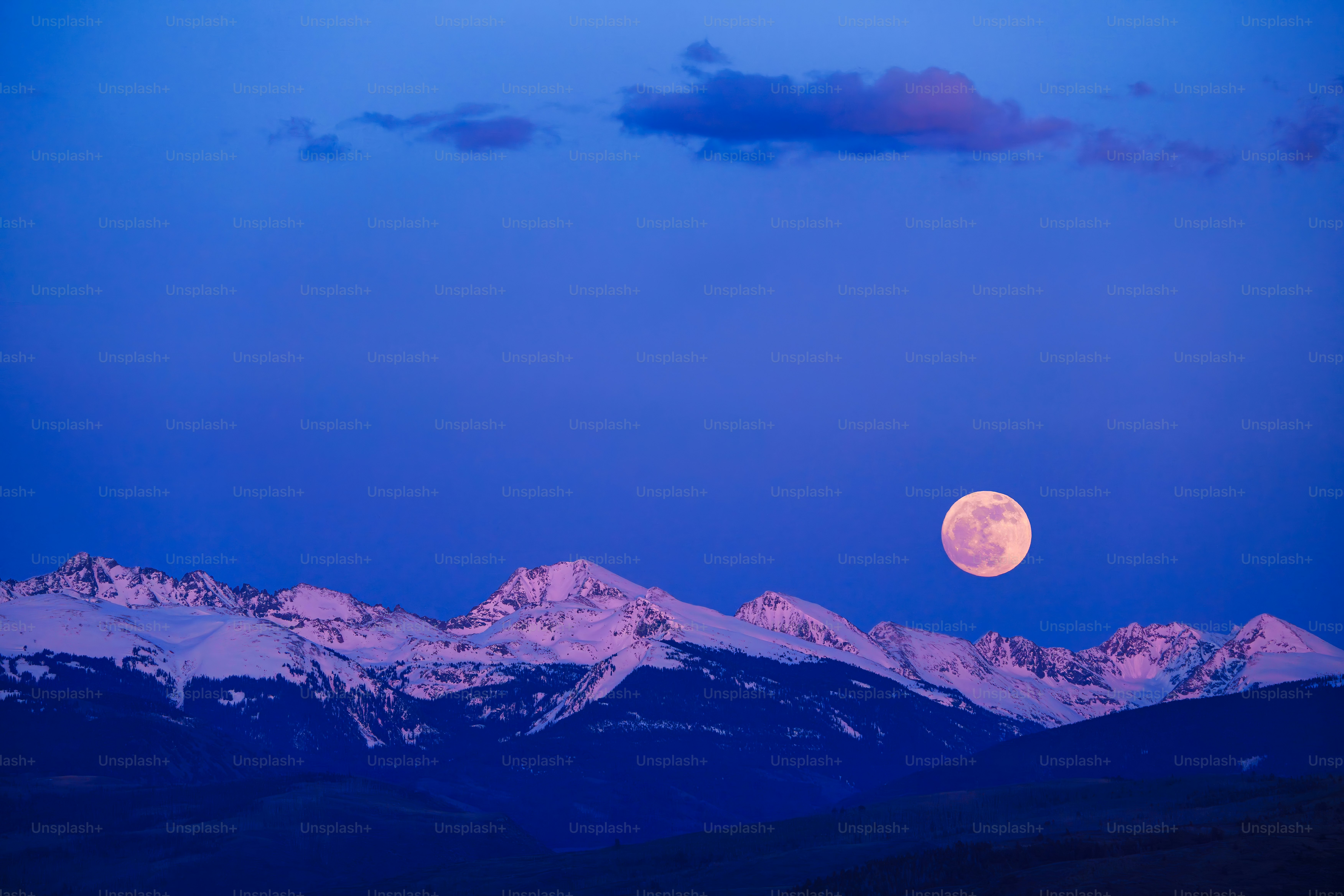 Moonrise Over Mountains Time Lapse - Full moon rising over rugged peaks ...