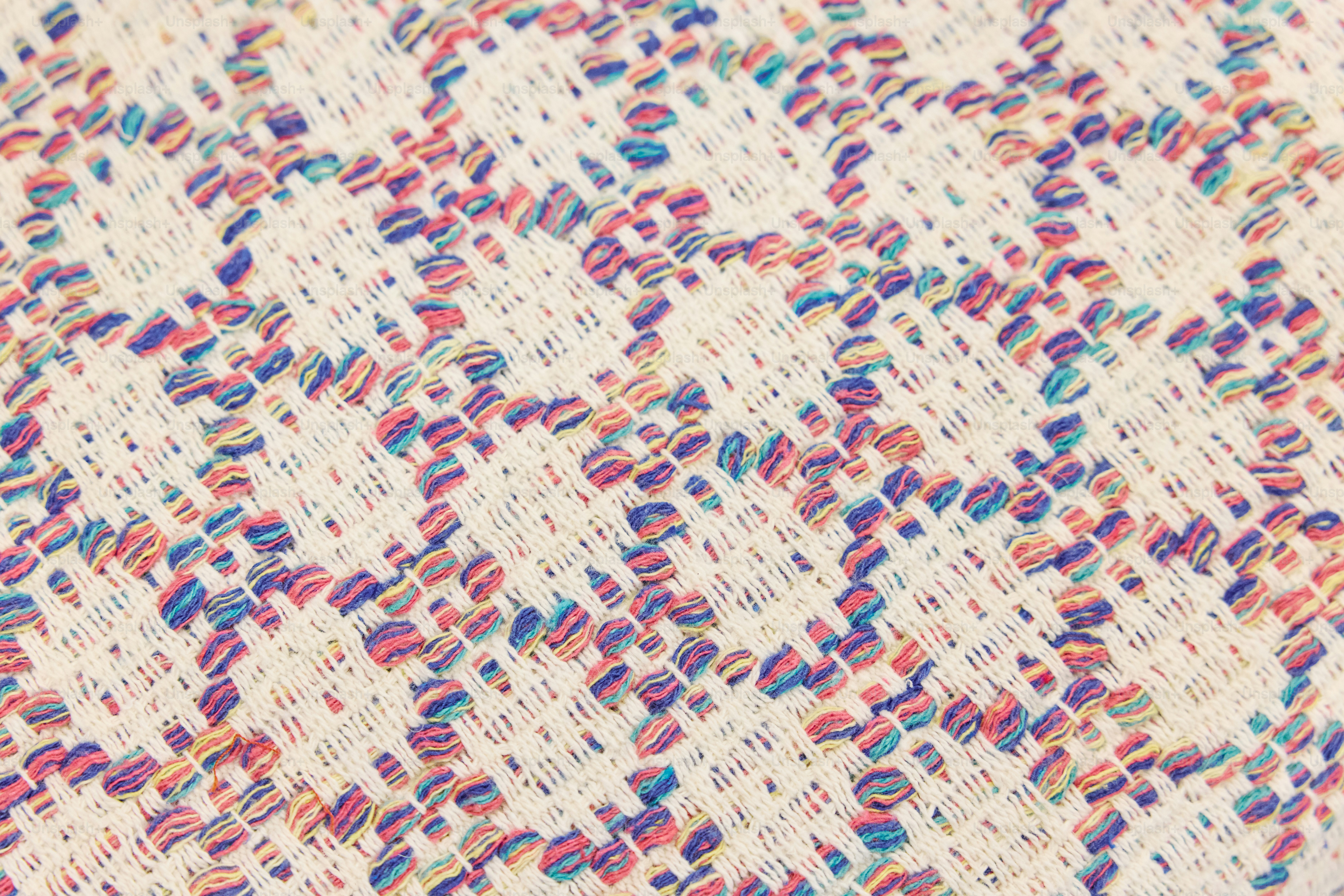 A close up of a white fabric with multicolored sprinkles photo – Rug ...