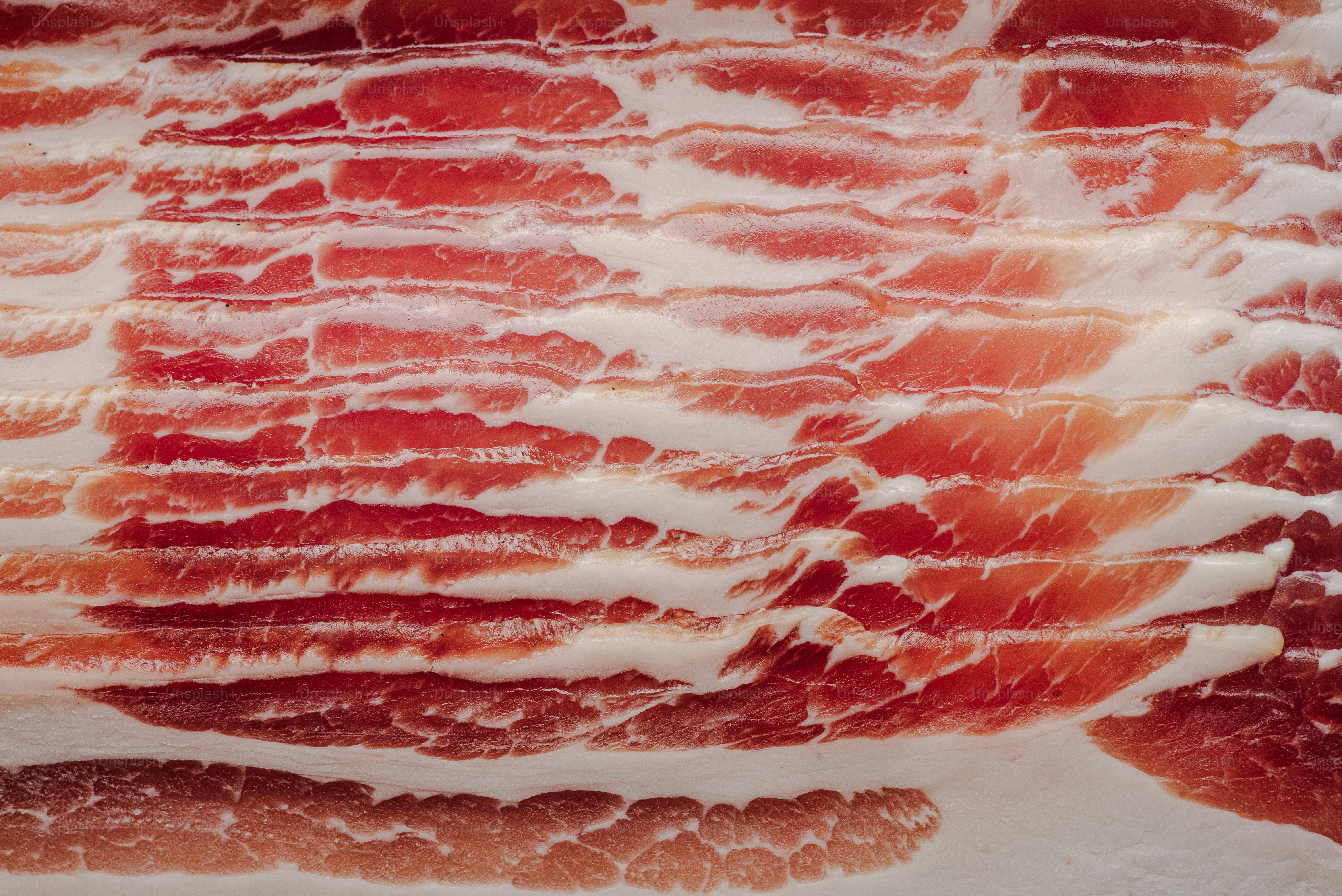 A large pile of bacon sitting on top of a counter photo – Food Image on ...