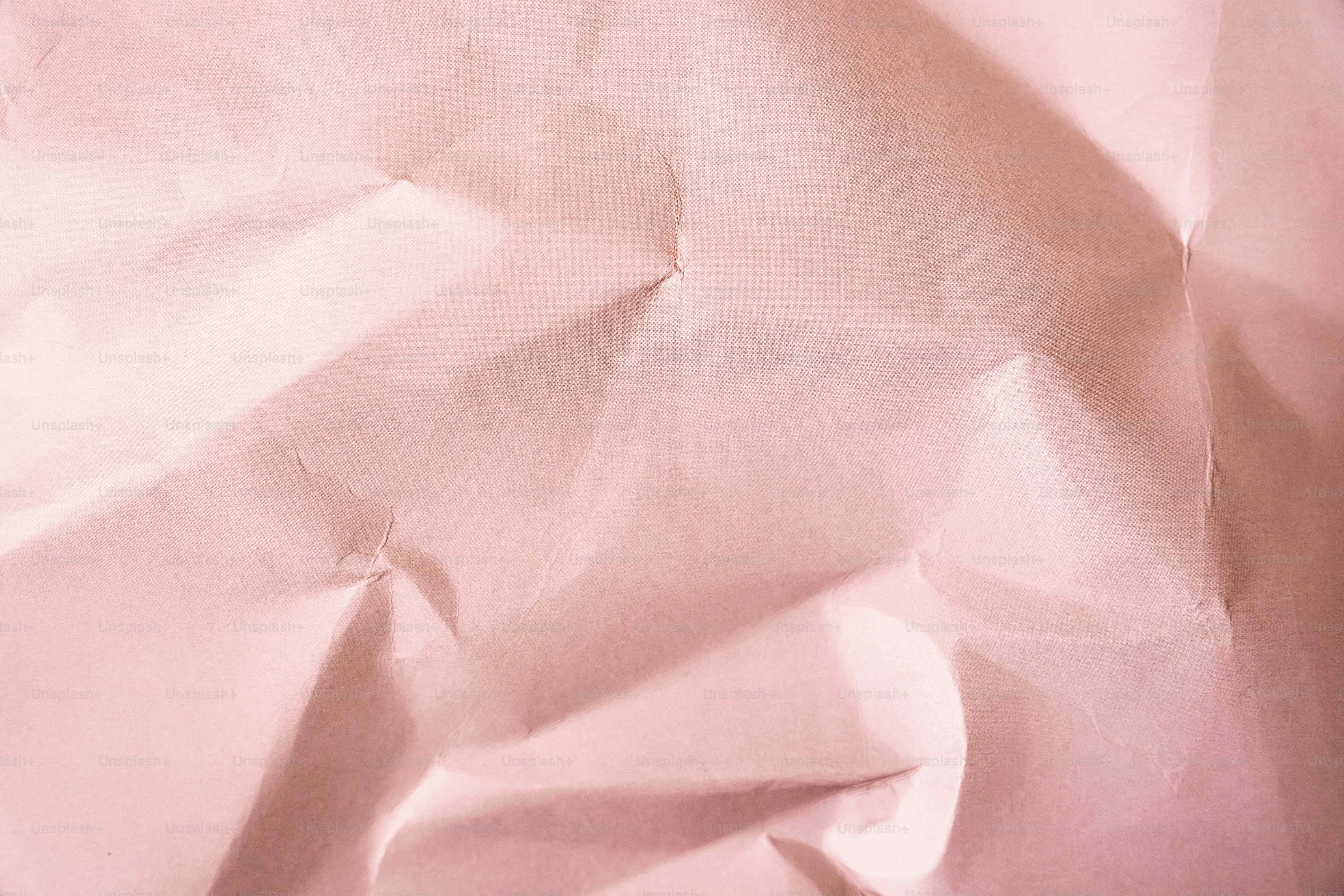 A close up of a piece of pink tissue paper photo – Paper texture Image ...