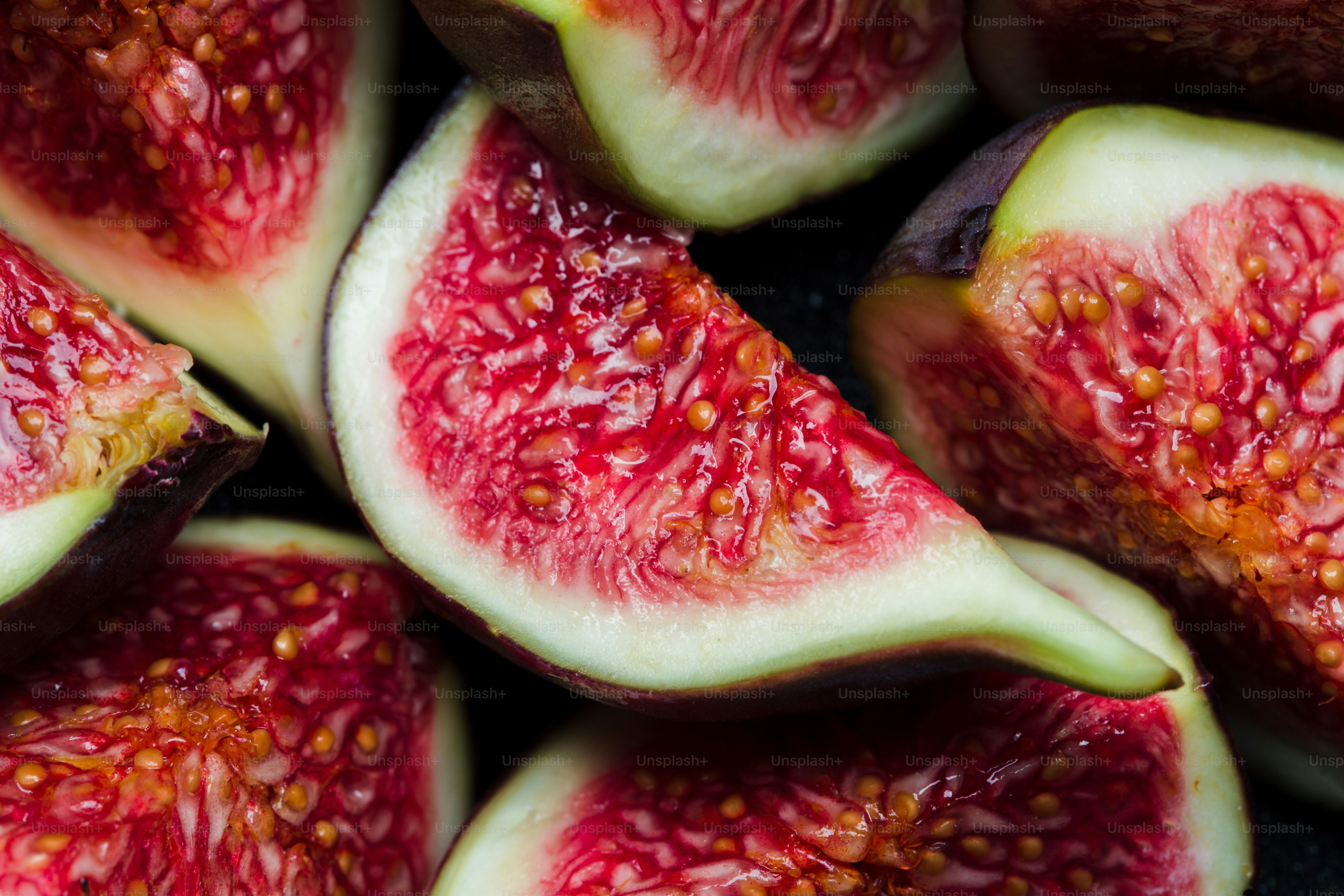 A close up of sliced figs on a plate photo – Food close ups Image on ...