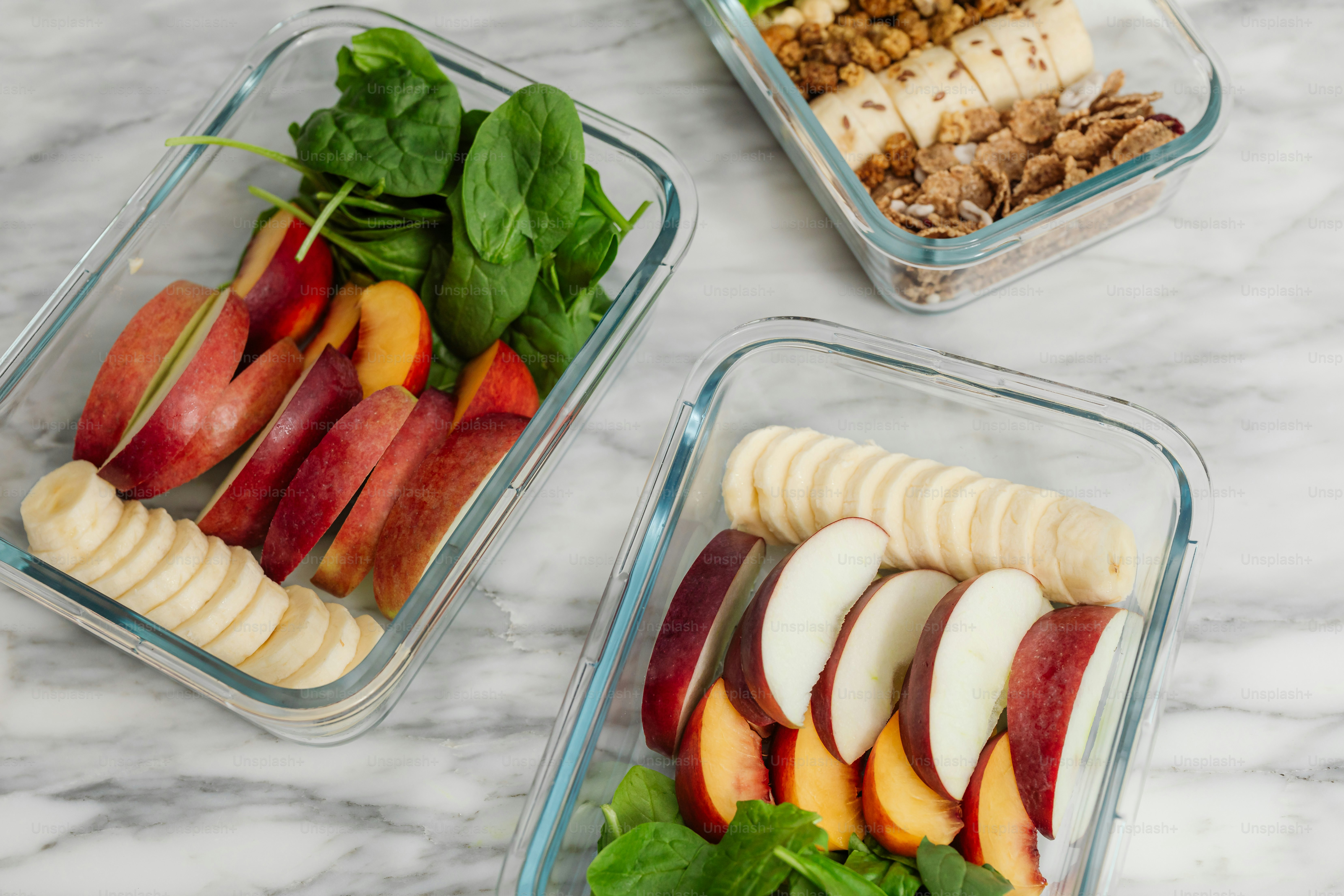 Four glass containers filled with different types of food photo – Meal ...