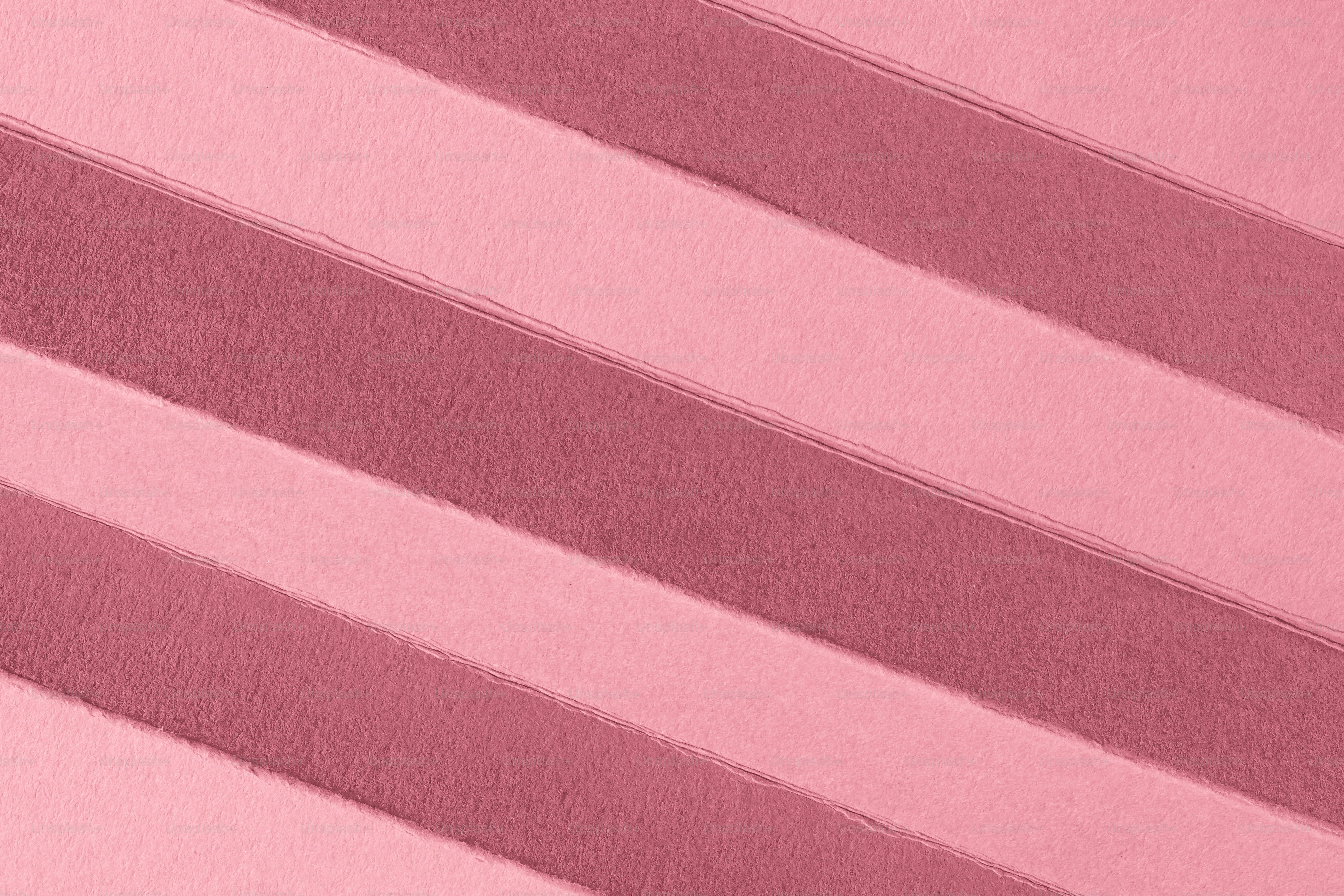 A close up of a pink background with horizontal stripes photo ...