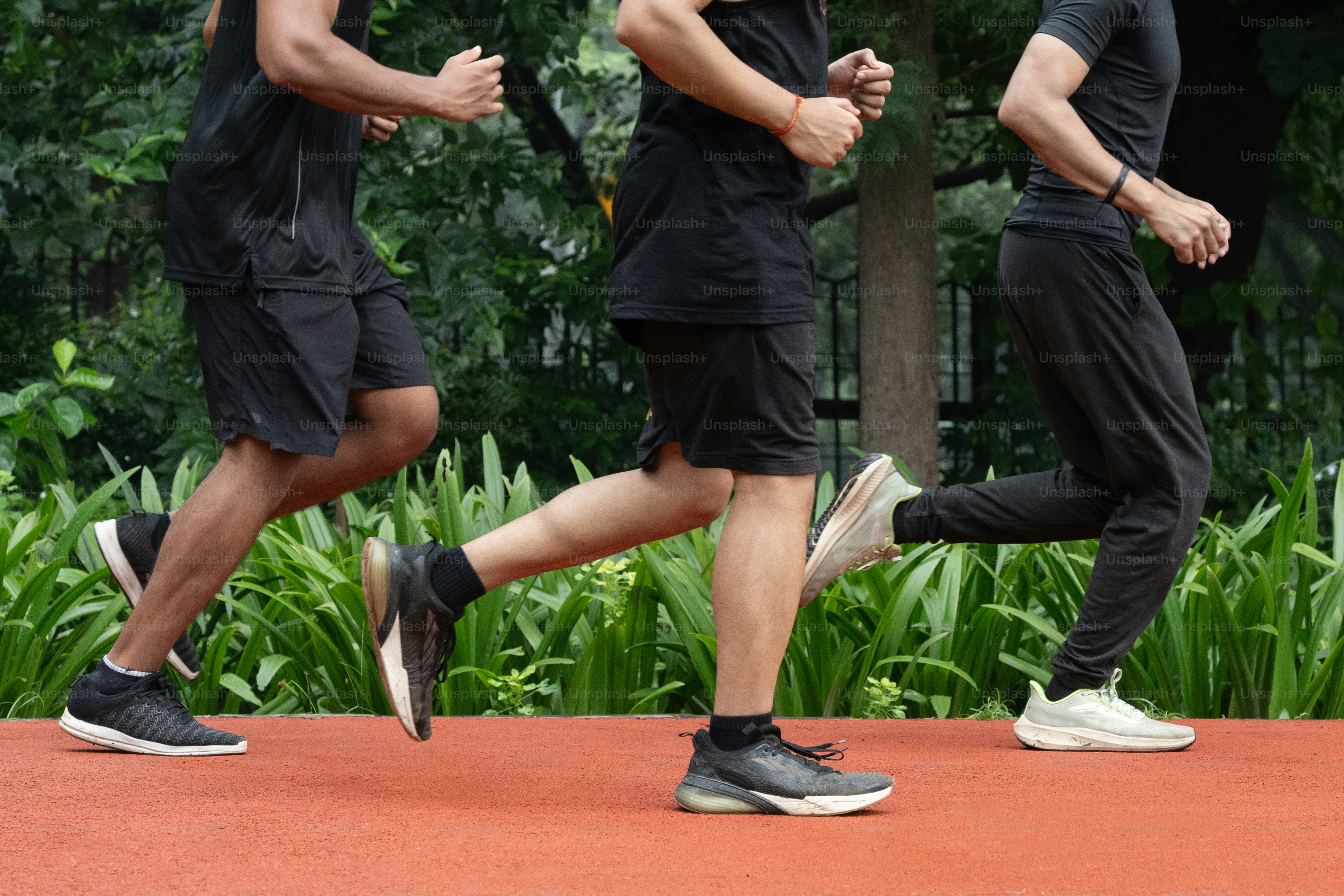 A group of men running on a path photo – Running Image on Unsplash