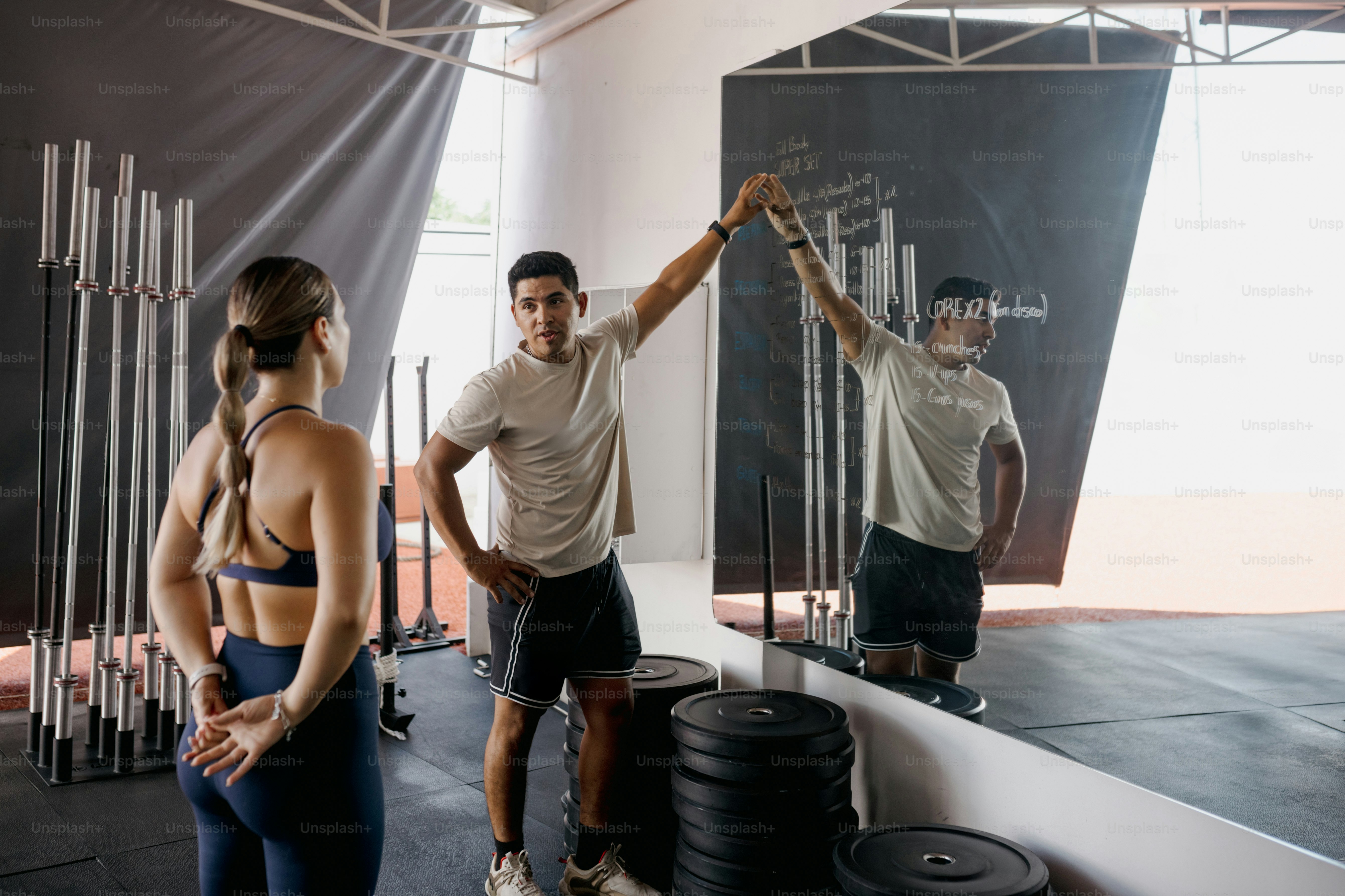 A group of people standing around a gym photo – Personal training Image on Unsplash