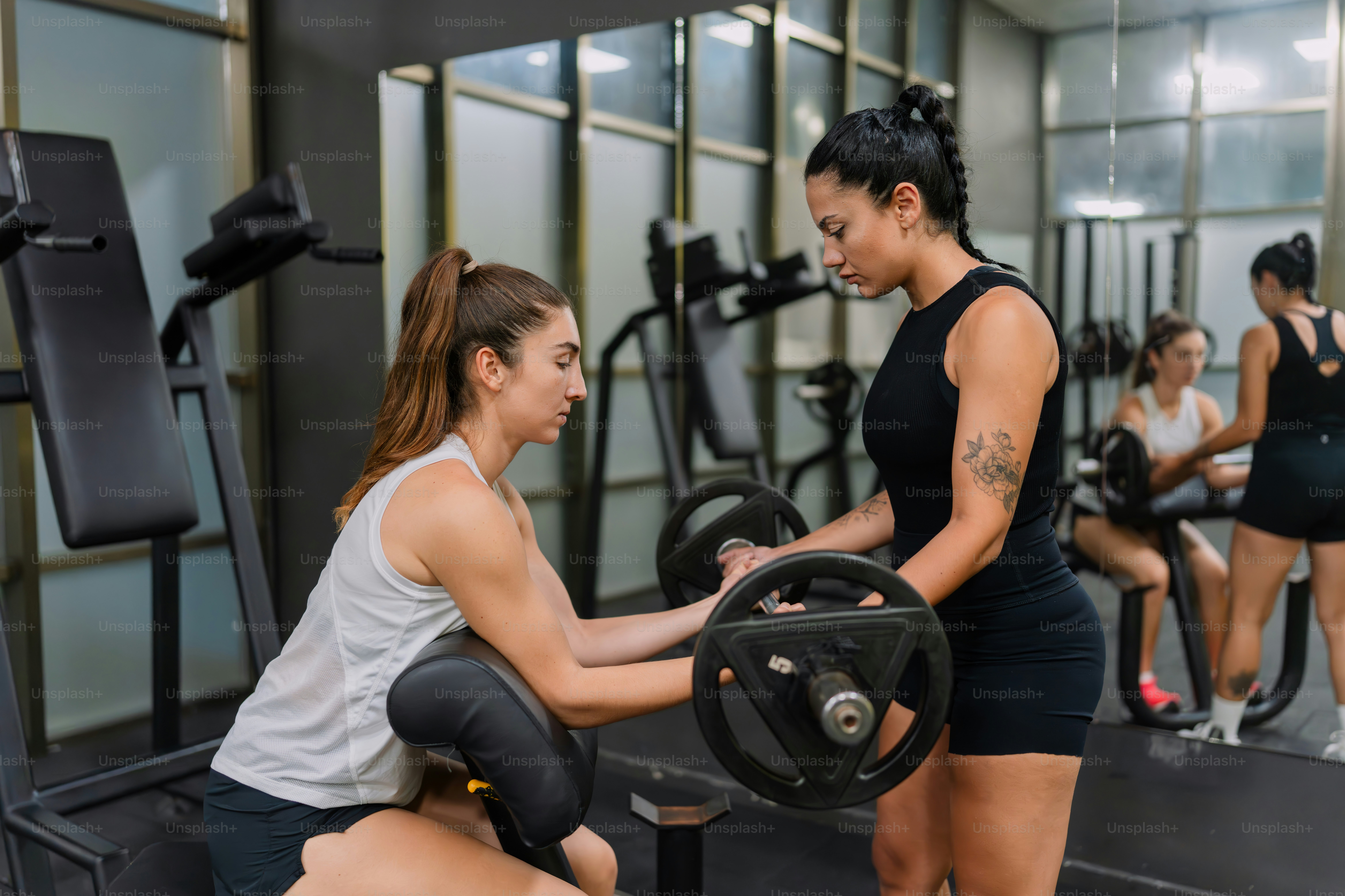 A group of women working out in a gym photo – Personal trainer Image on ...