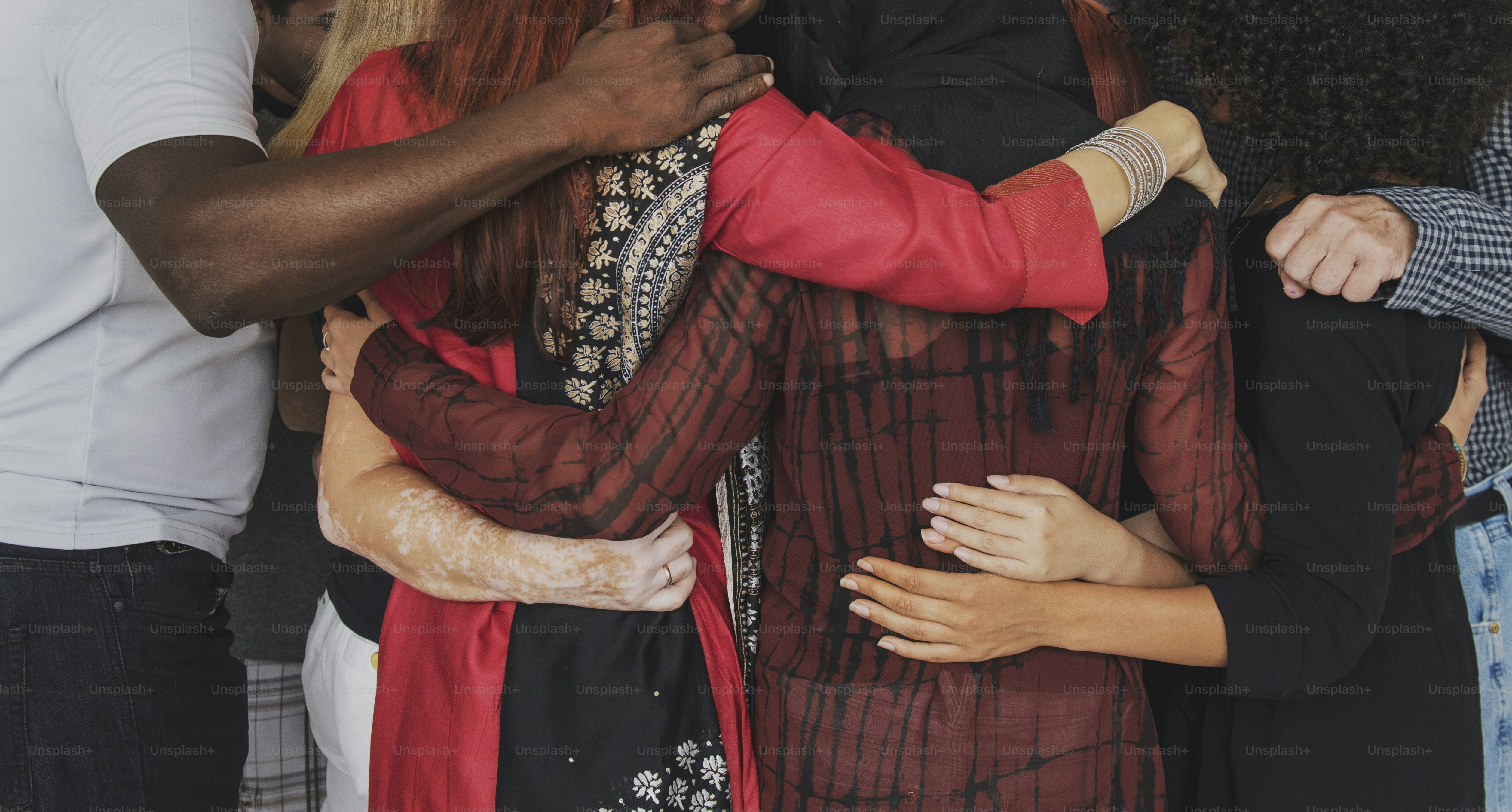 Group of people huddle together photo – Human back Image on Unsplash