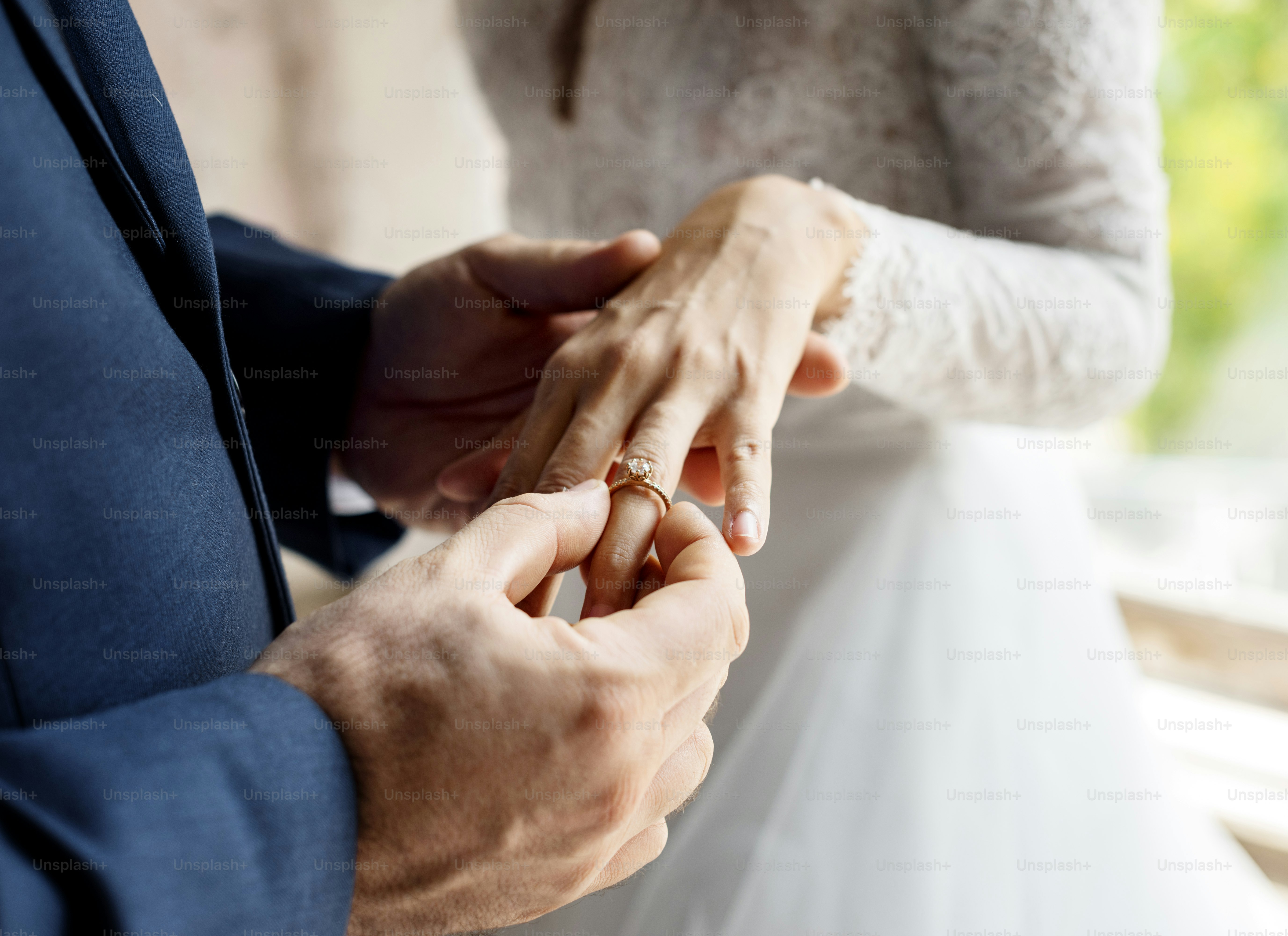 Groom Put on Wedding Ring Bride Hand photo – Newlywed Image on Unsplash