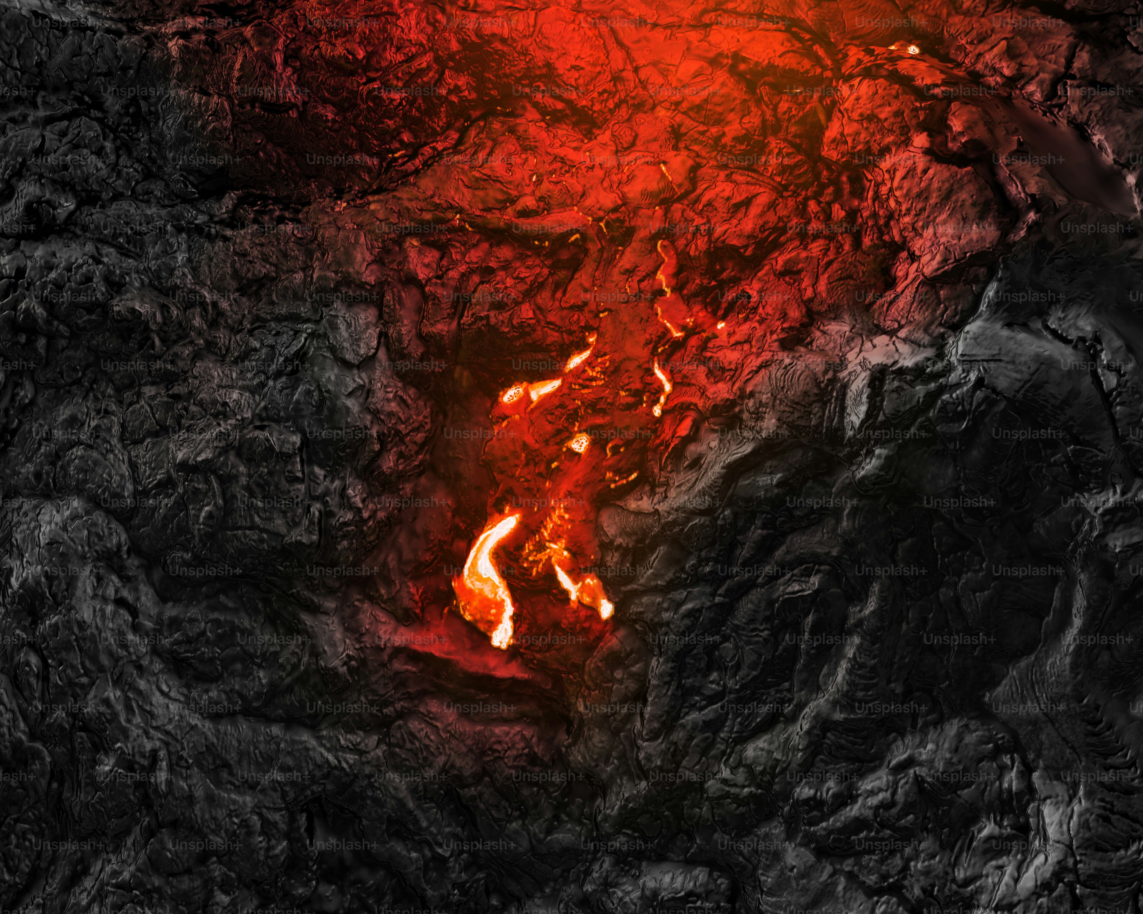A lava with a red light coming out of it photo – Wallpaper Image on ...